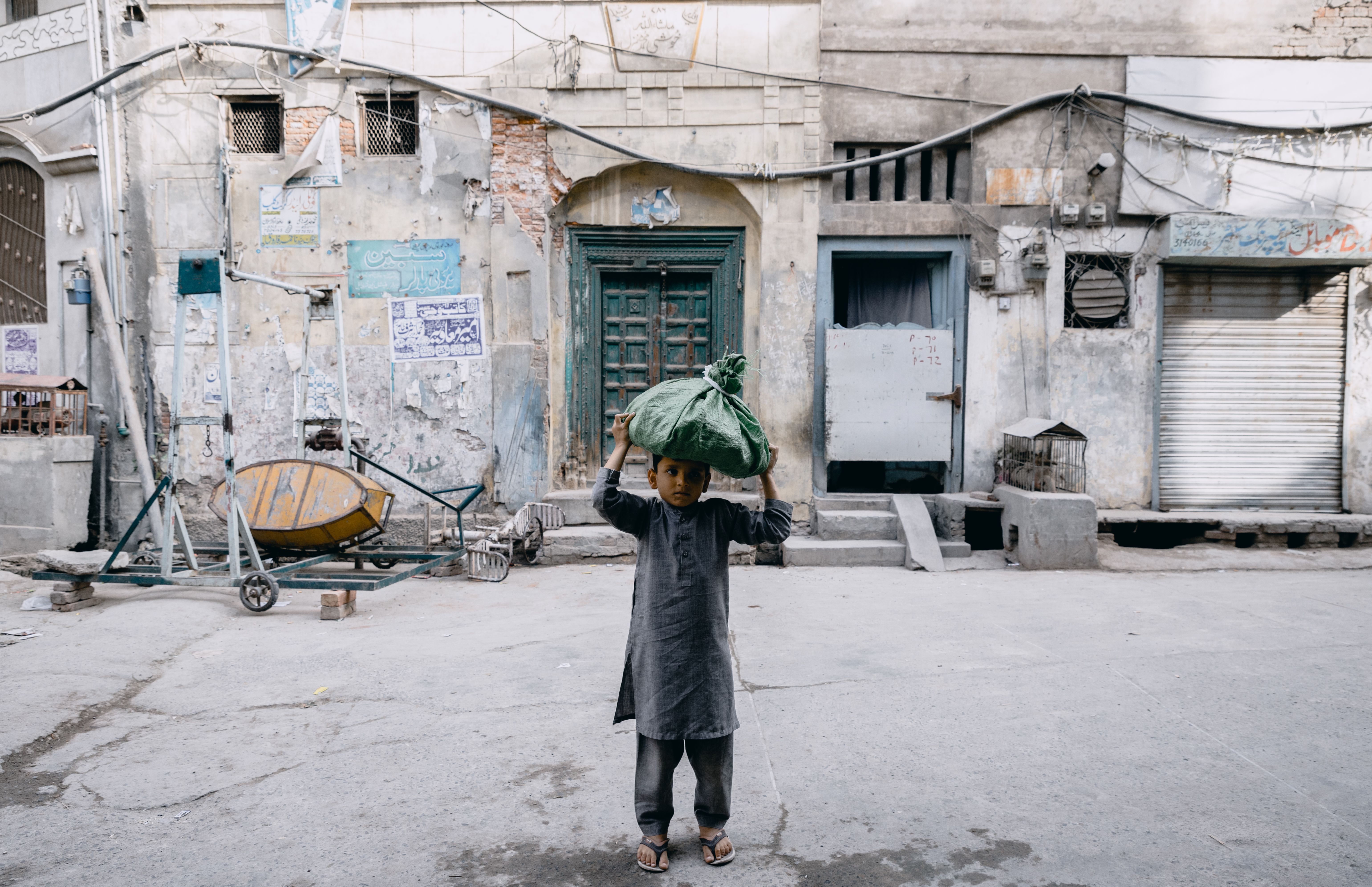 Boy Child Carrying a Pot in a Hand · Free Stock Photo