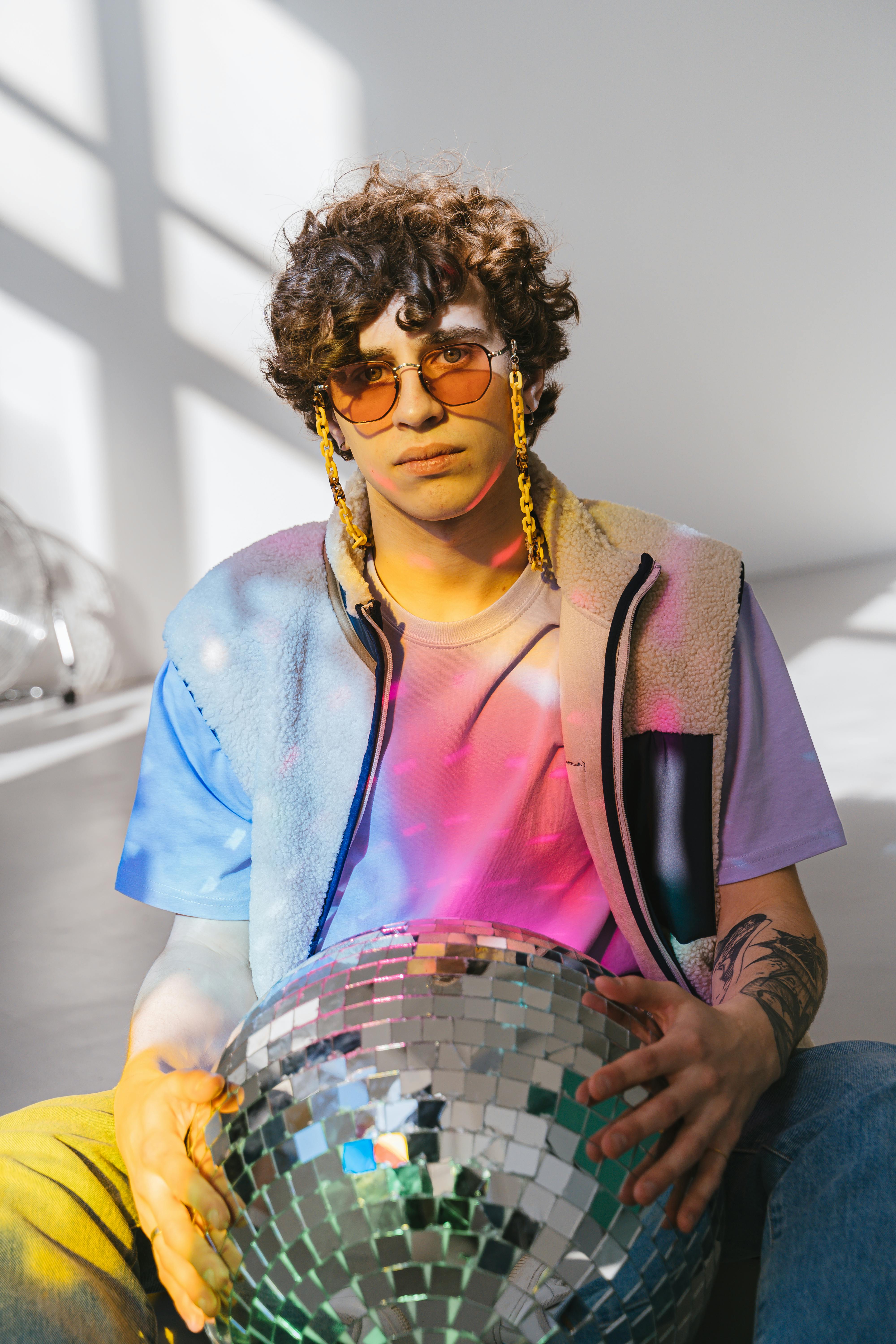 A Man Holding a Disco Ball · Free Stock Photo