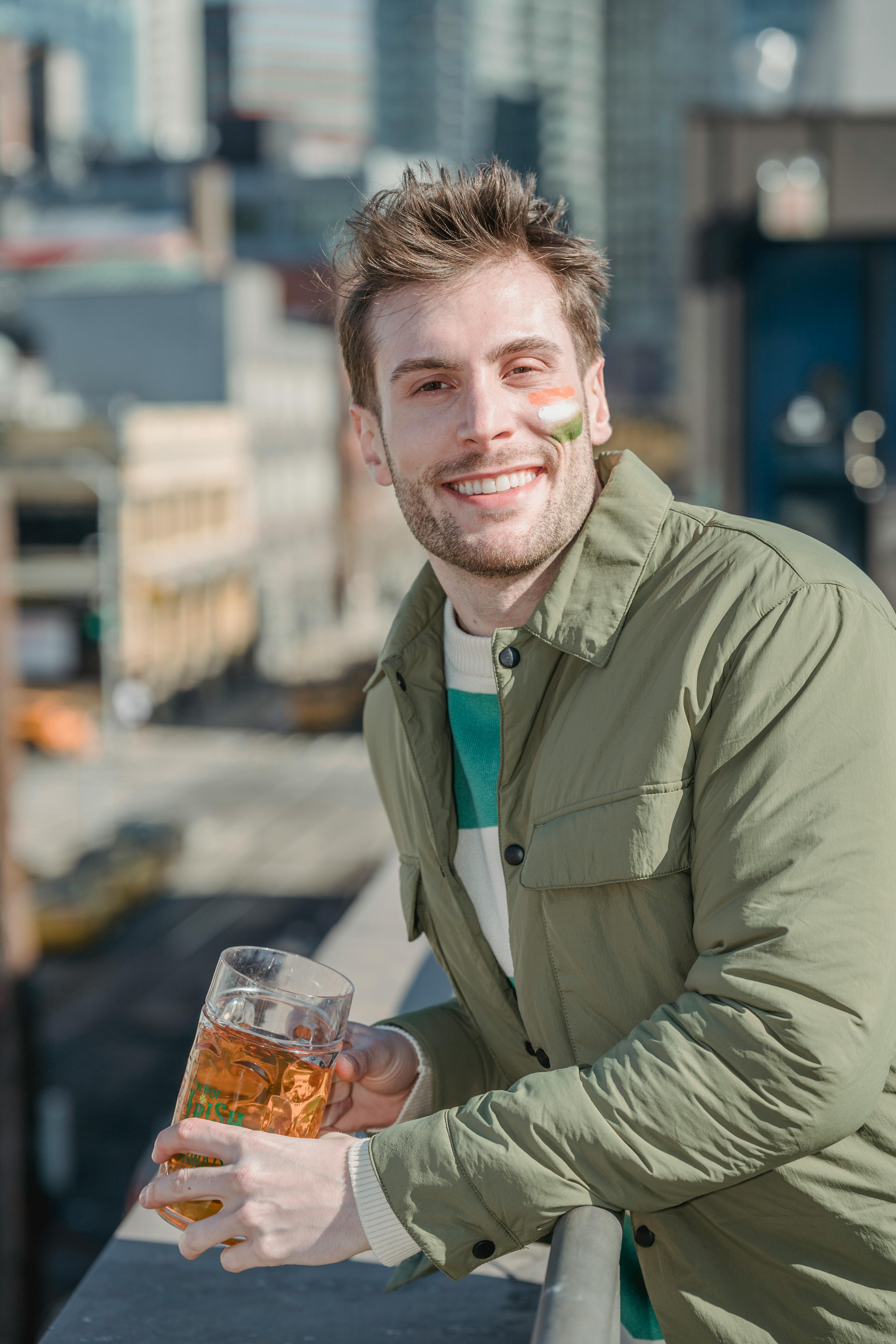 Young man with beer in hand · Free Stock Photo