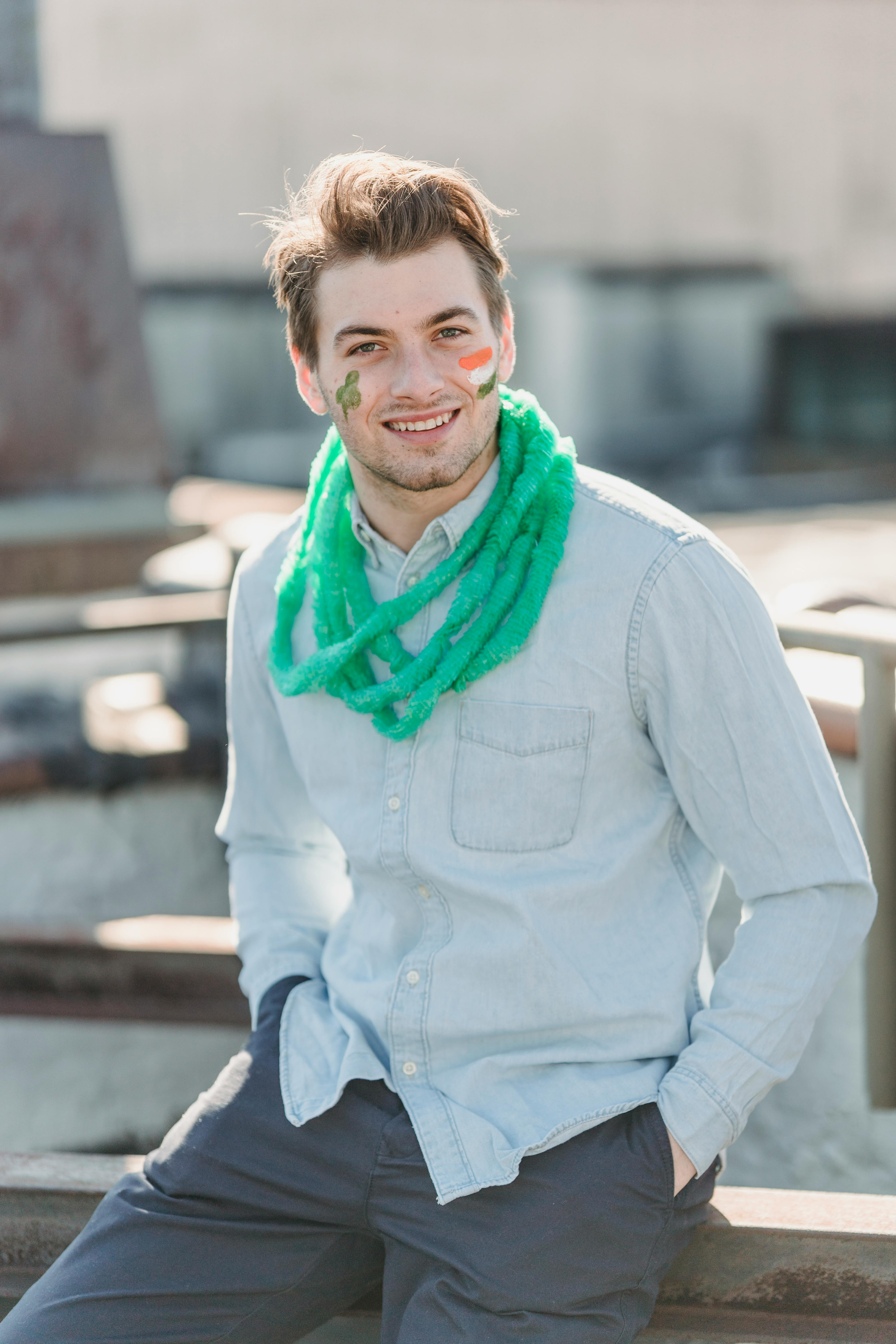 Smiling man with green scarf · Free Stock Photo