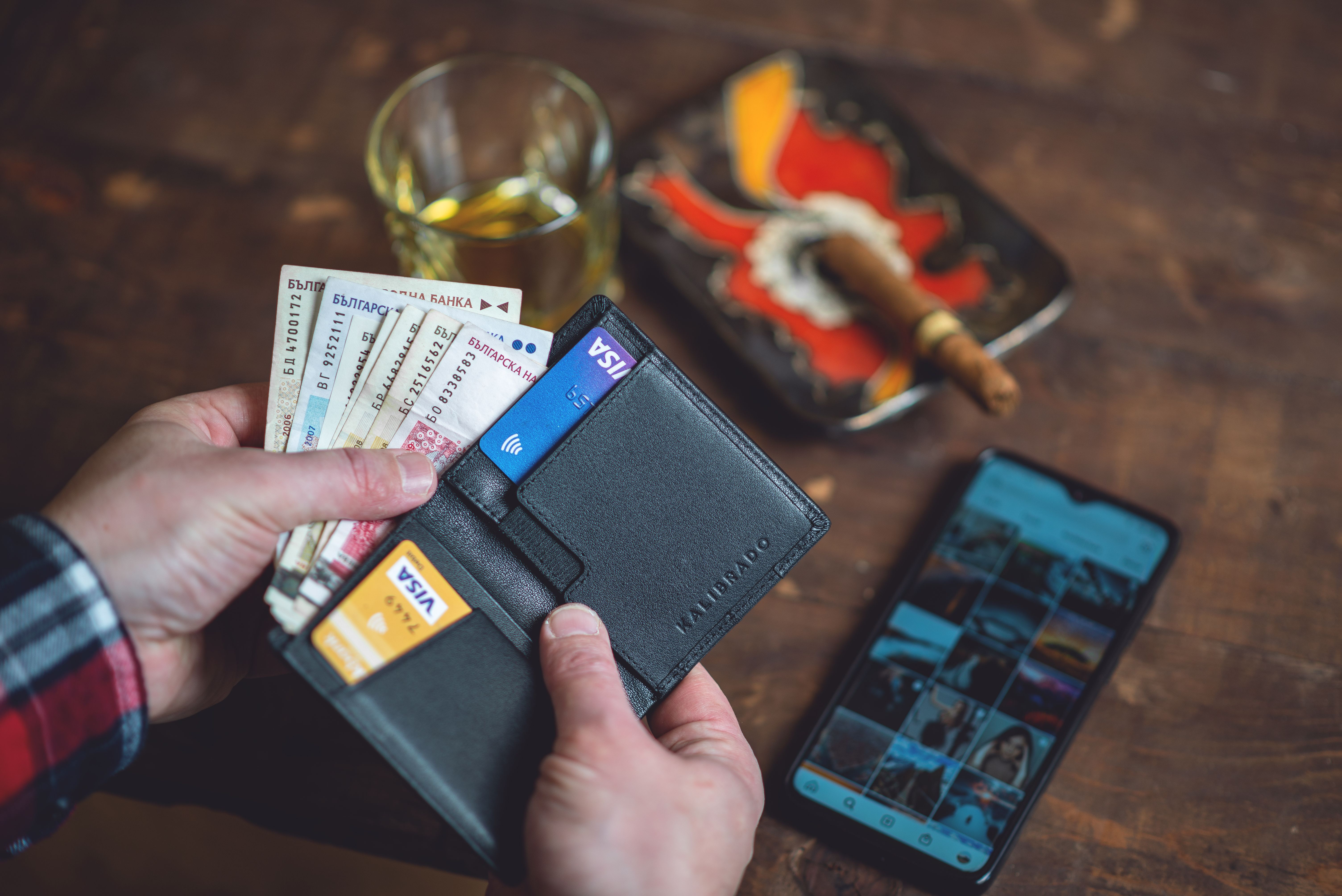 A Person Holding an Empty Wallet · Free Stock Photo