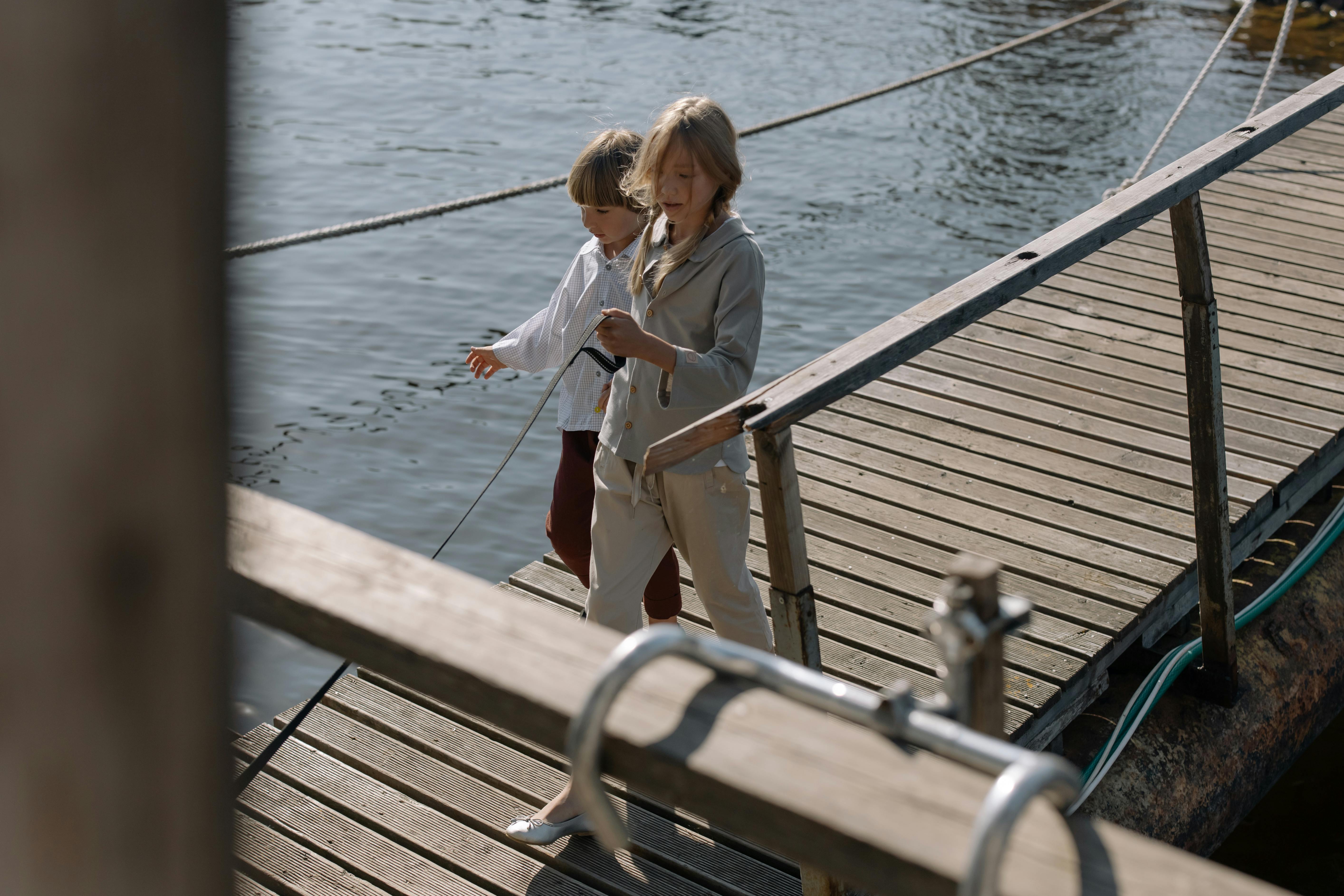 Children Walking on a Boardwalk · Free Stock Photo