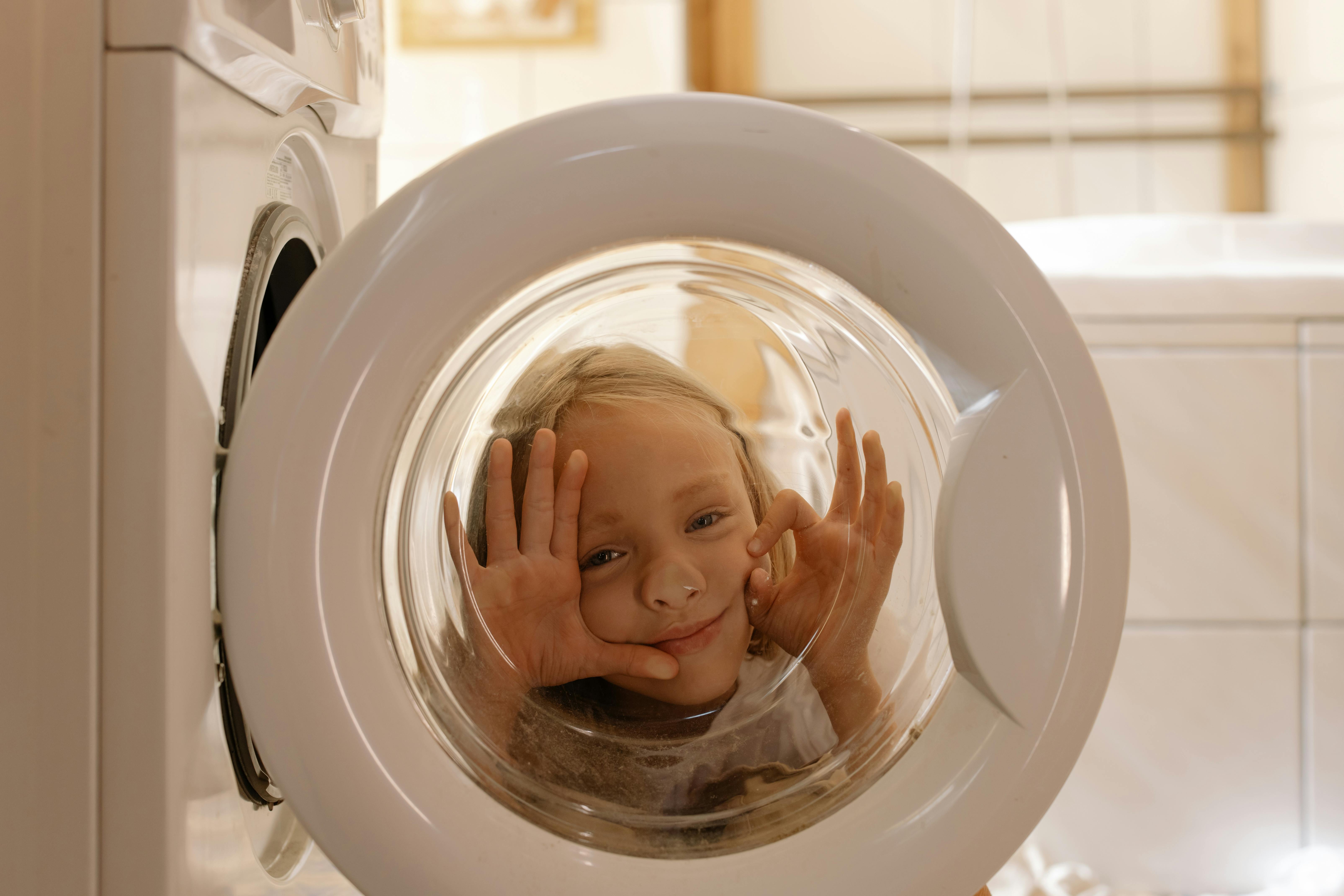 Fashion Model sitting in a washing machine · Free Stock Photo