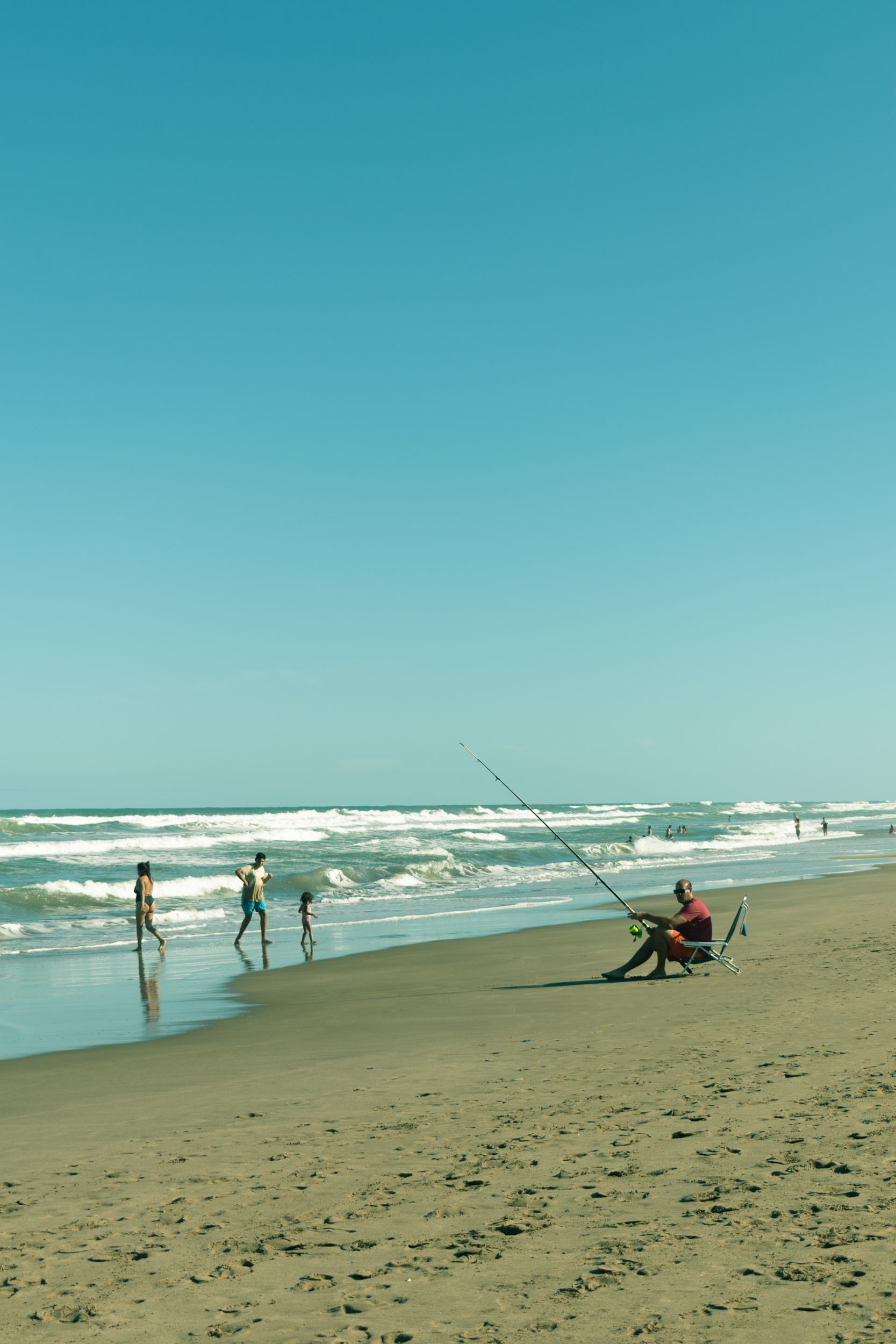 Photo of Person Walking Along Seashore · Free Stock Photo