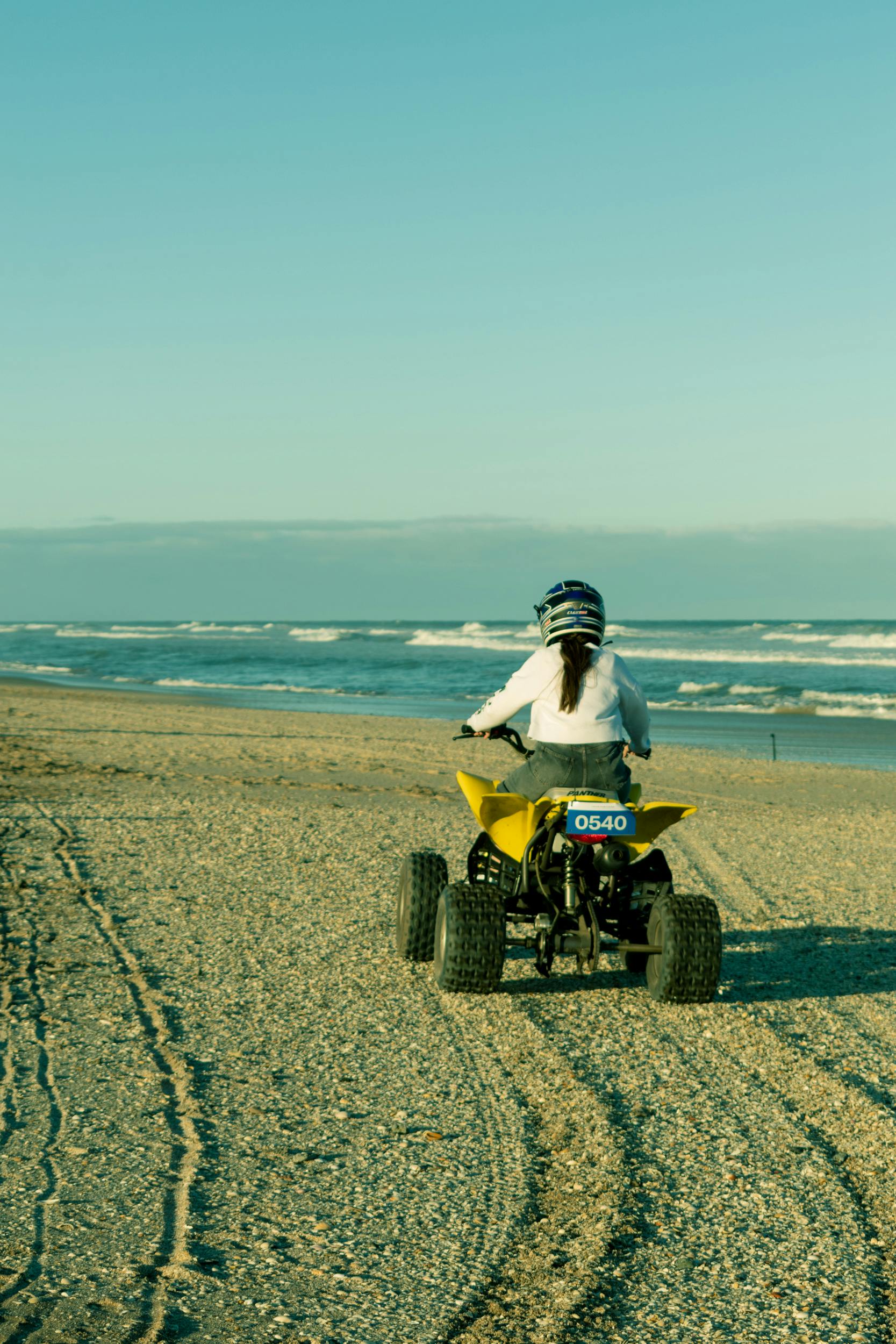 A Person Riding an Atv on the Beach · Free Stock Photo