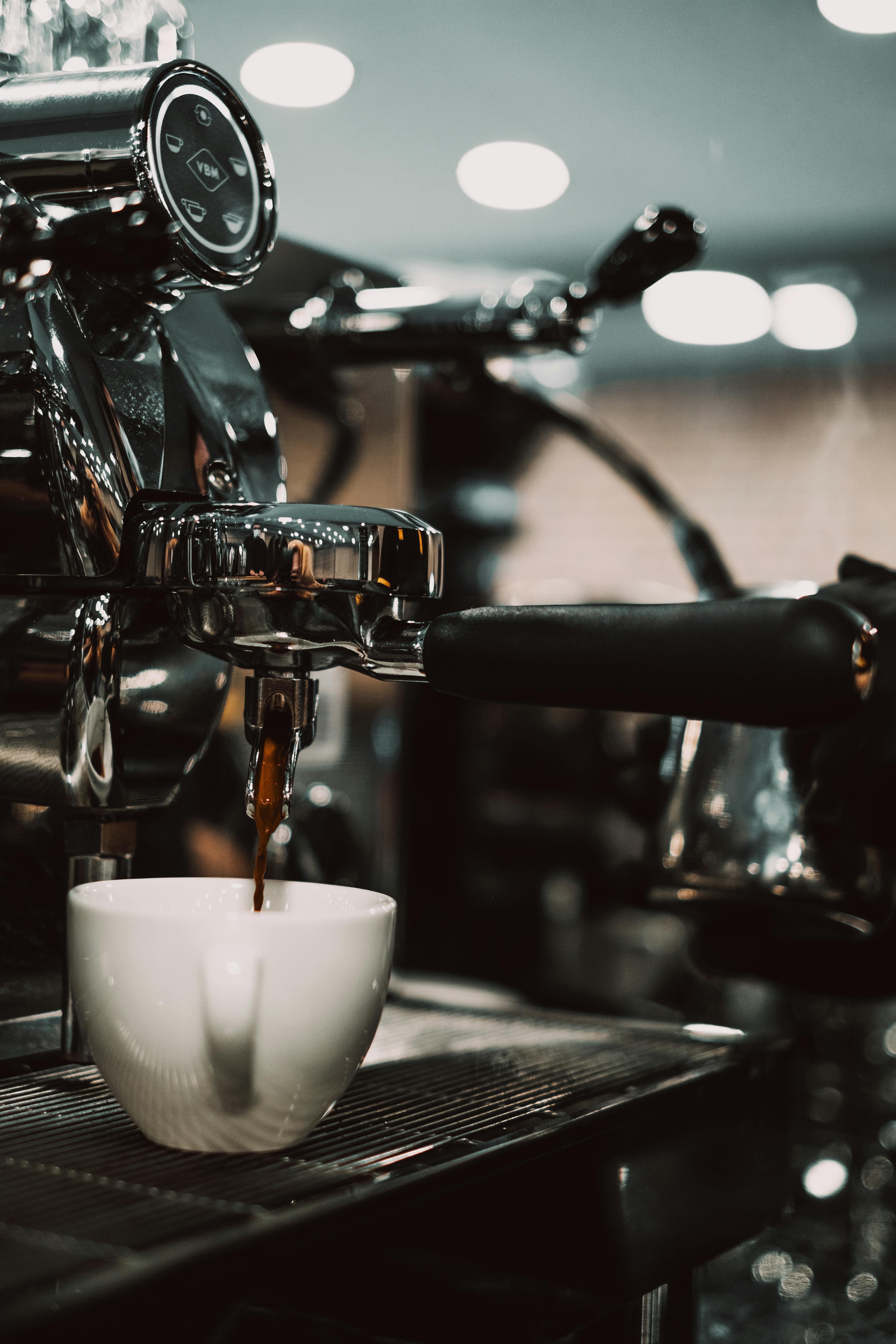 A Ceramic Cup on a Coffee Machine · Free Stock Photo