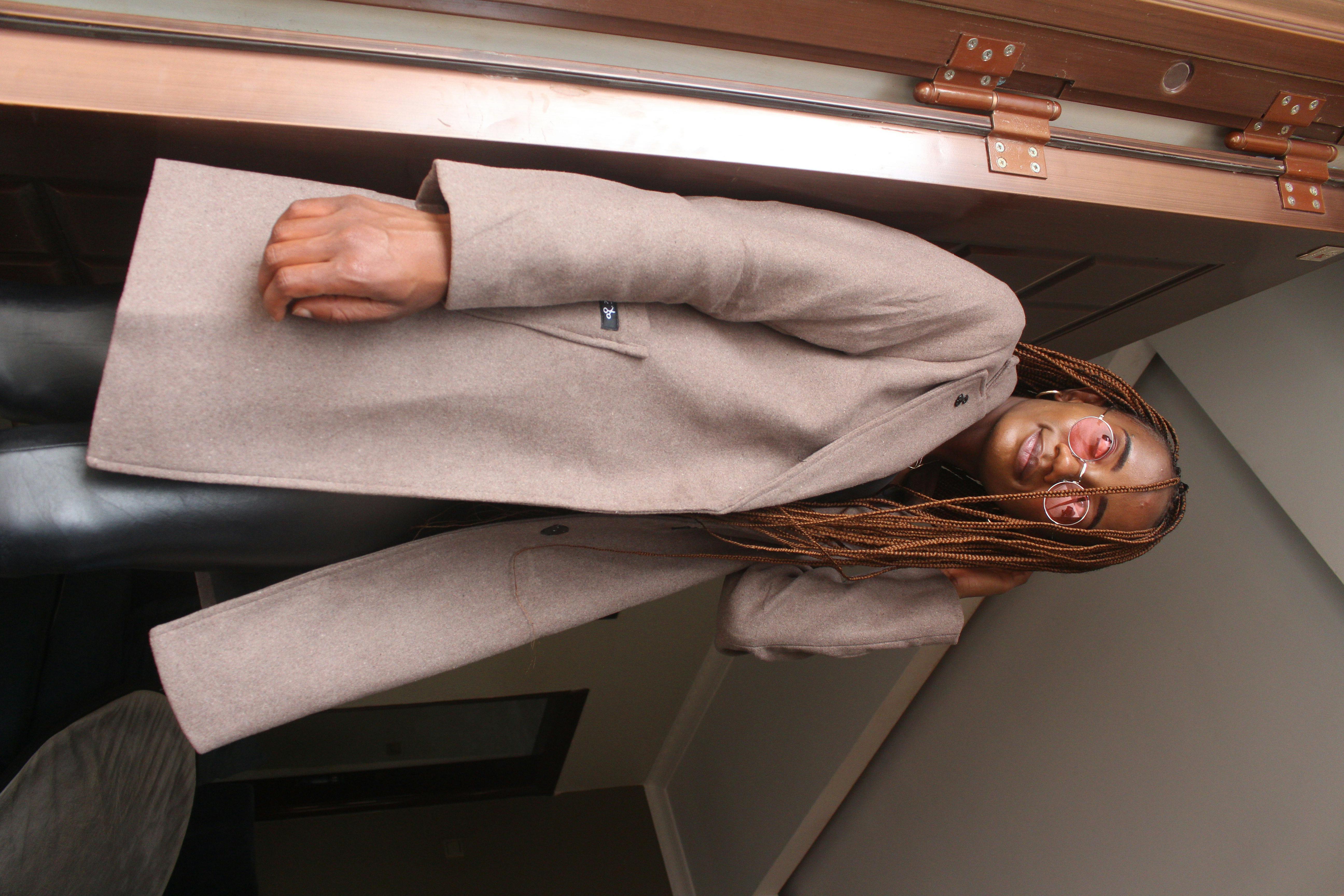 Woman with a Long Braid Sanding in the Field · Free Stock Photo