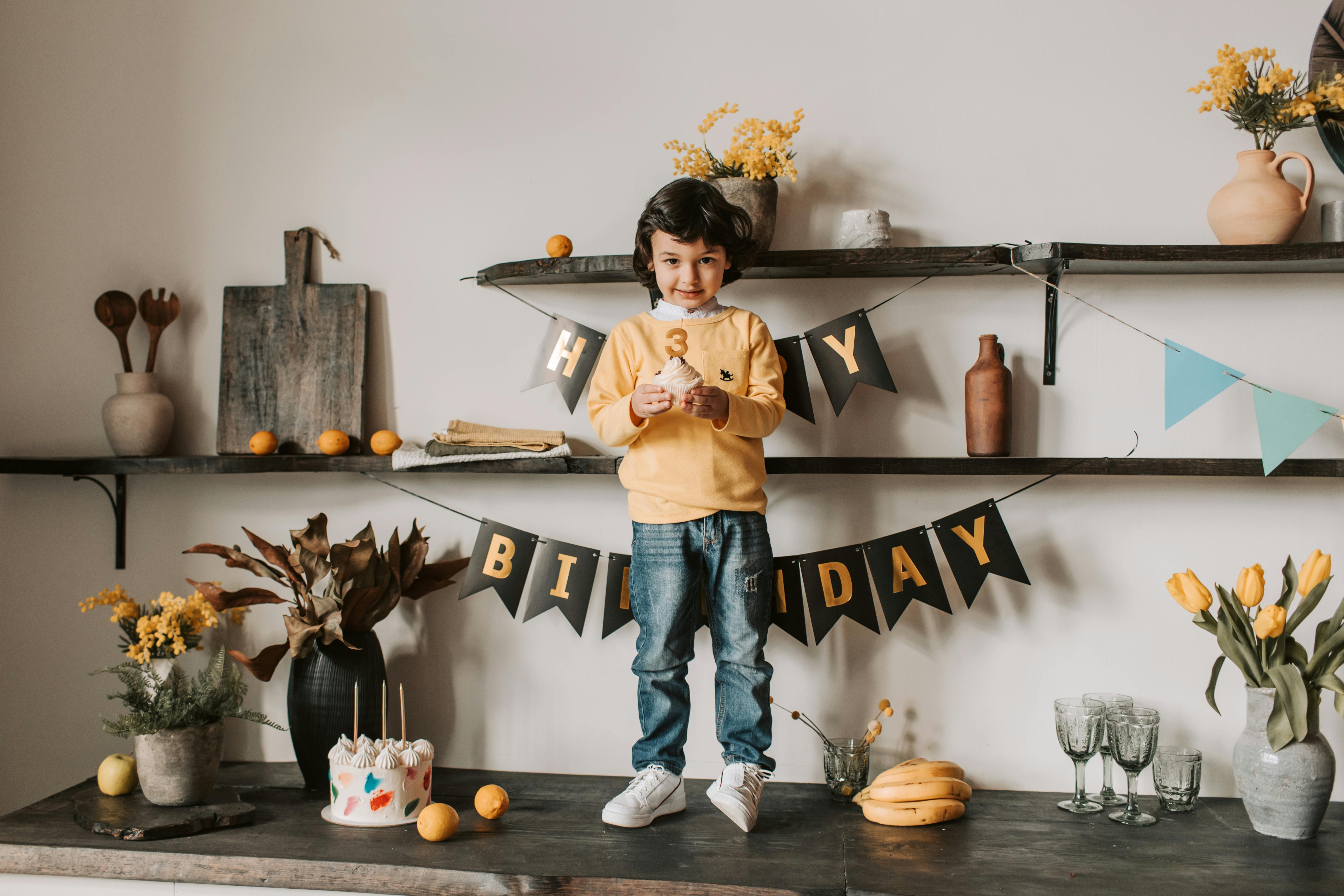 Little Boy Standing on Wooden Table · Free Stock Photo