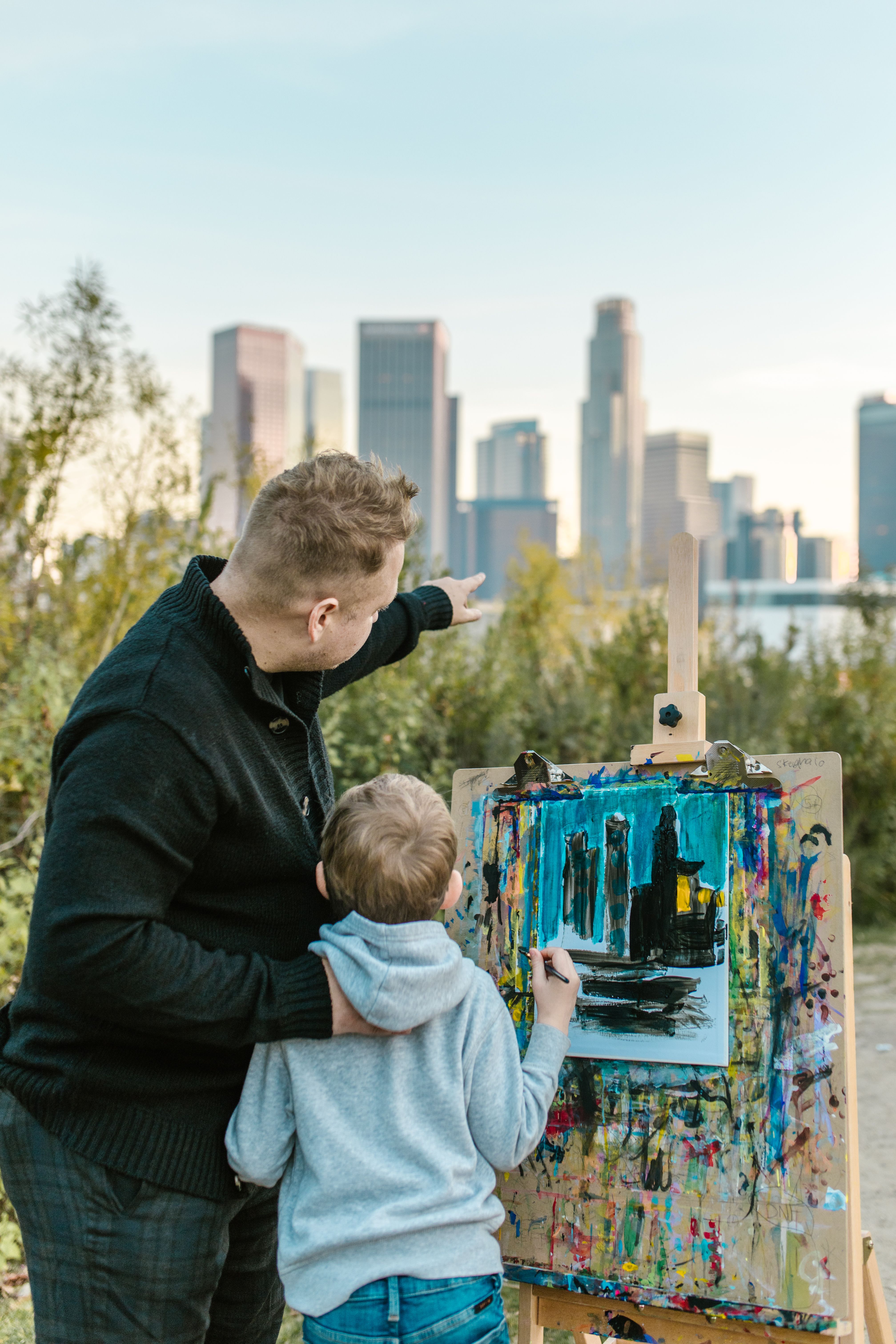 Man Helping a Young Boy · Free Stock Photo