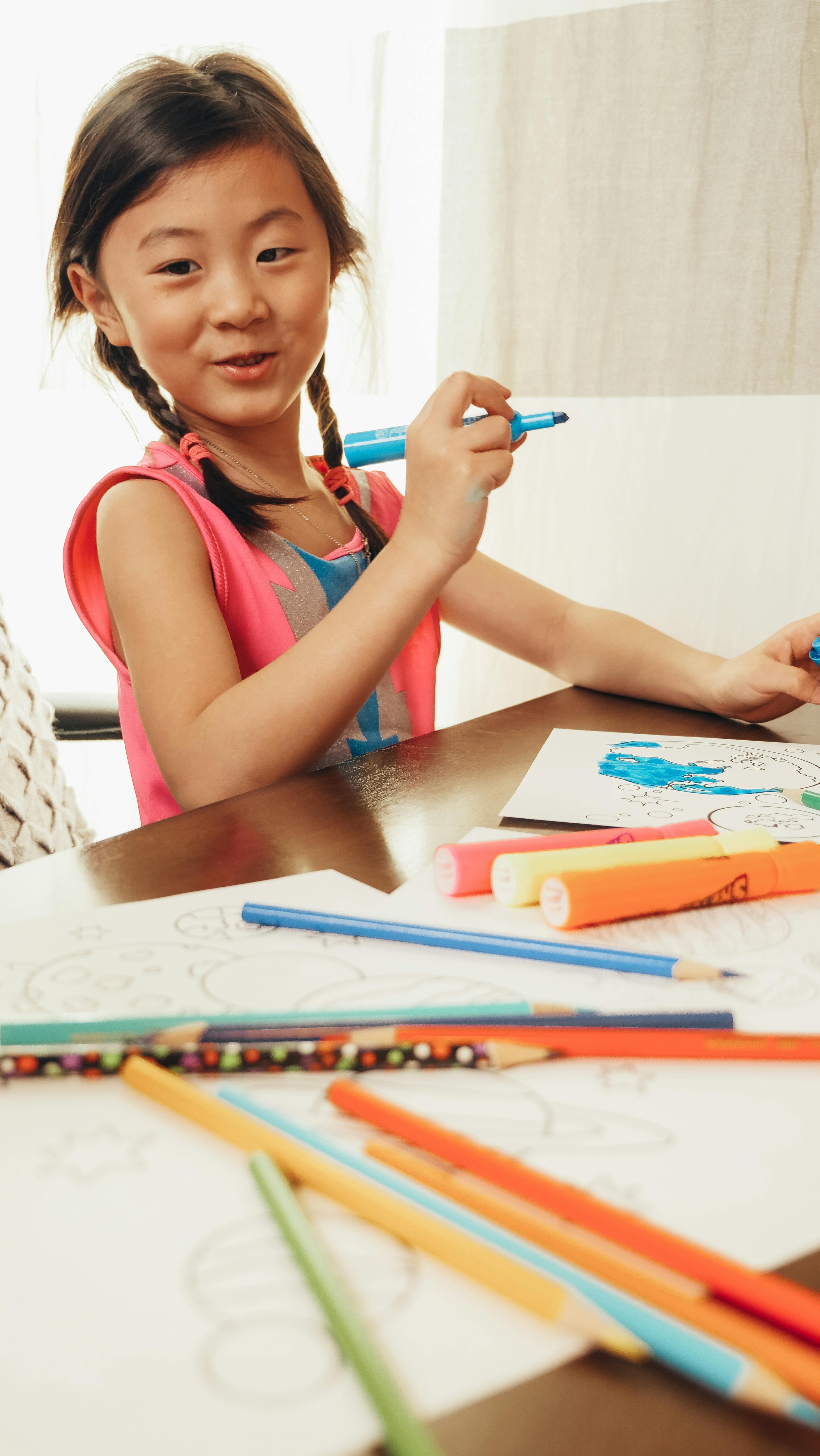 A Girl Sitting by the Lake and Drawing · Free Stock Photo