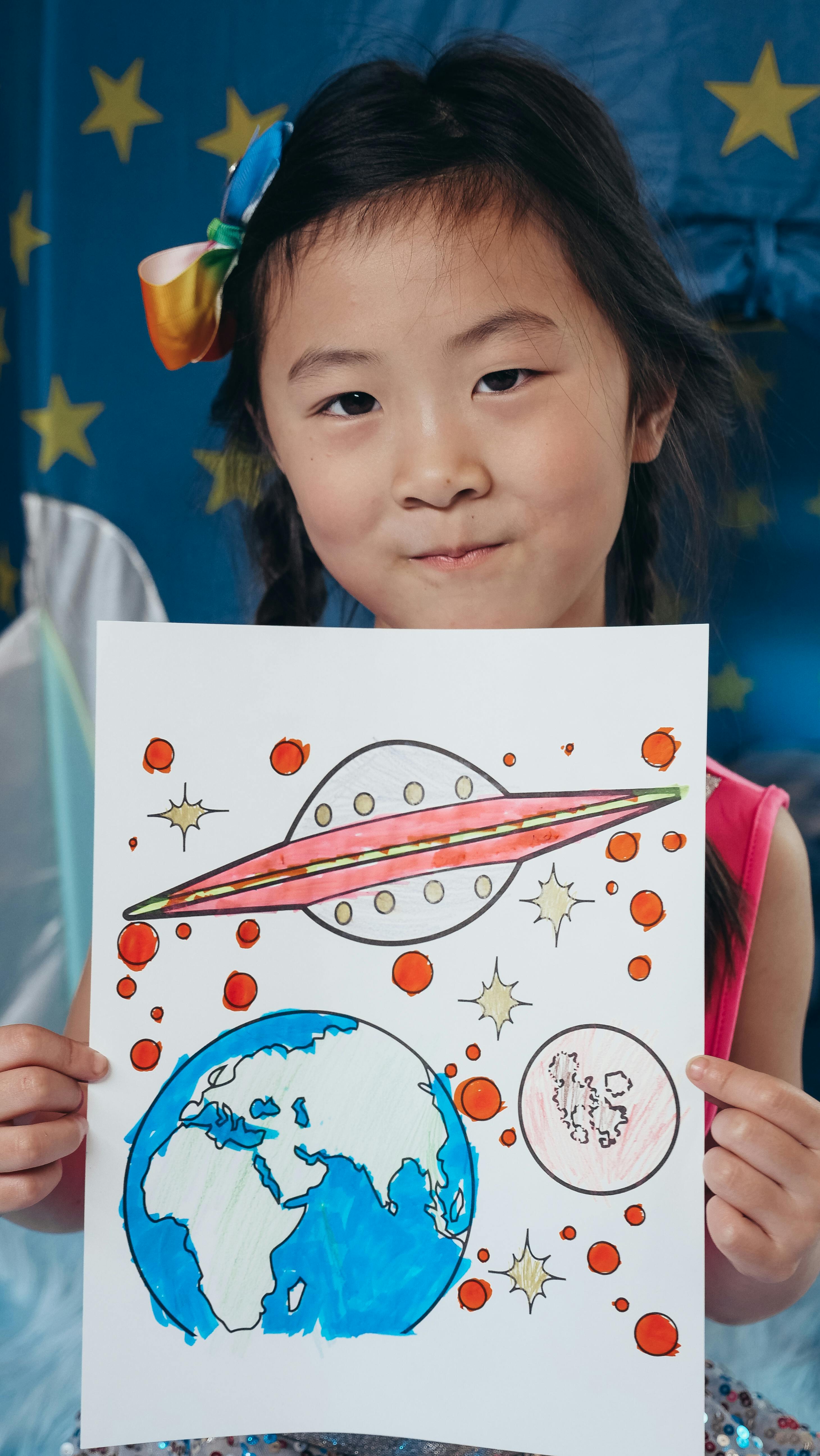 Cute Girl Showing Artwork · Free Stock Photo