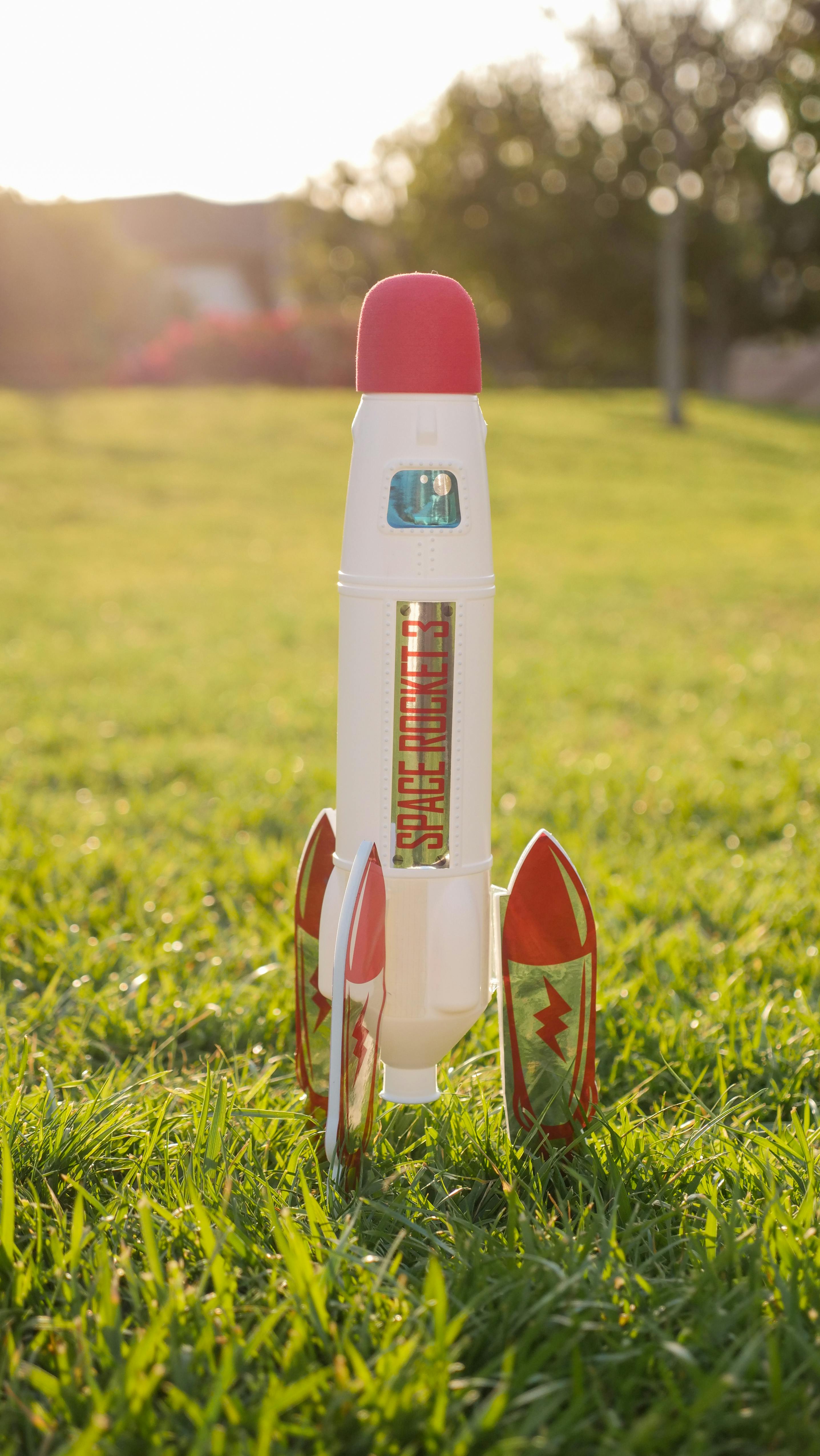 Close-Up Shot of a Rocket on the Grass · Free Stock Photo