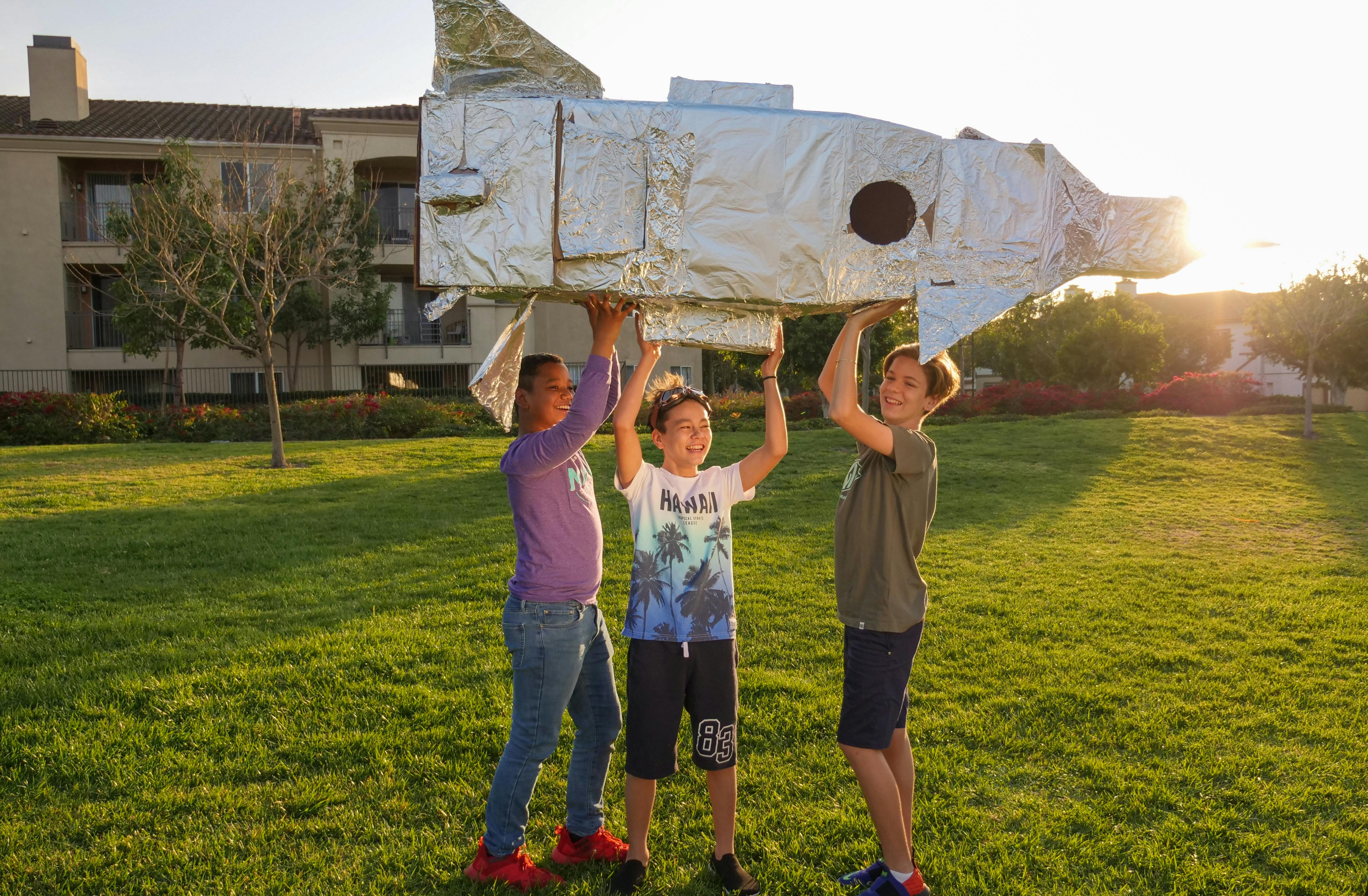 Kids Playing with Cardboard Boxes · Free Stock Photo