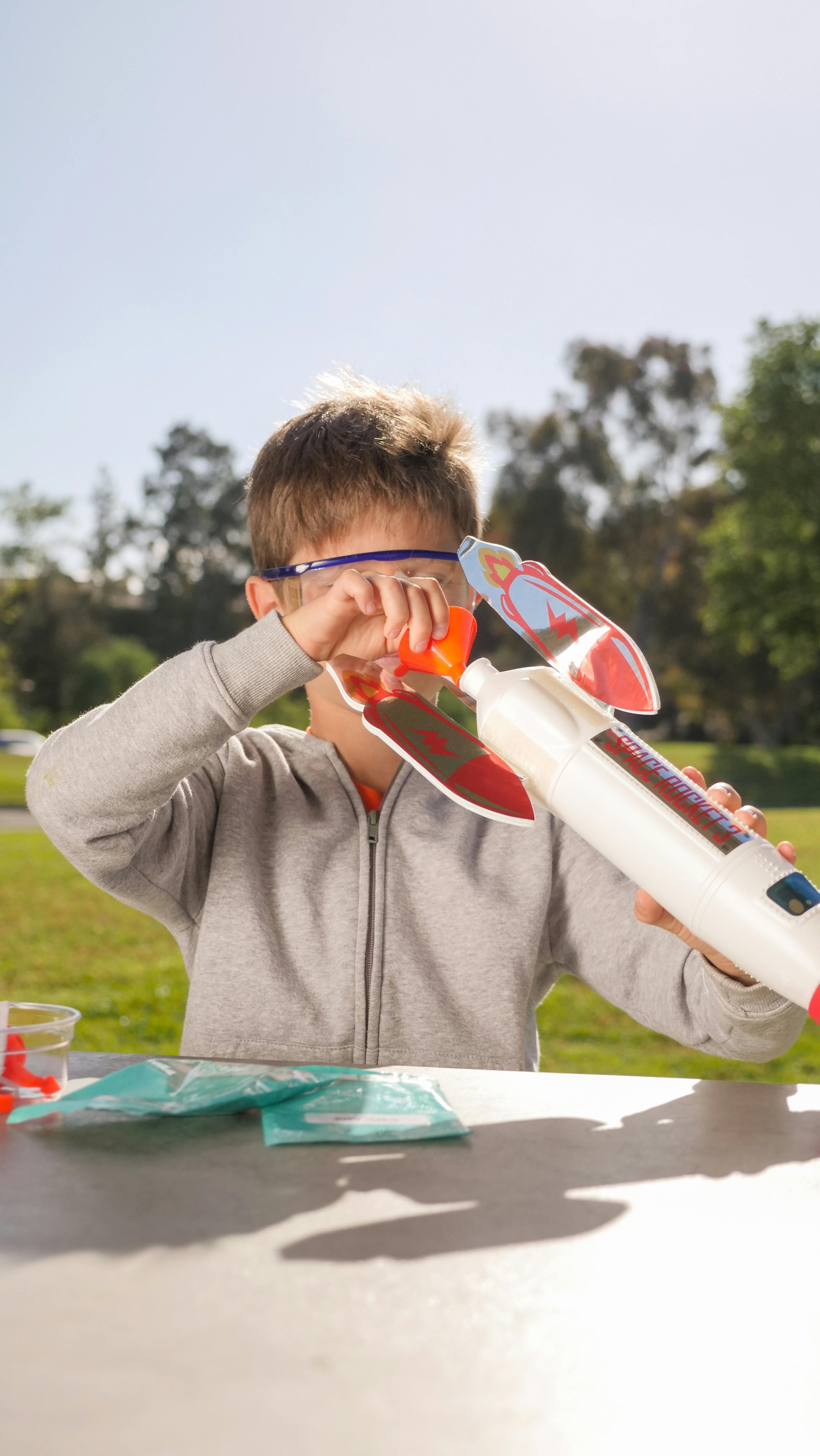 A Boy Playing a Rocket · Free Stock Photo