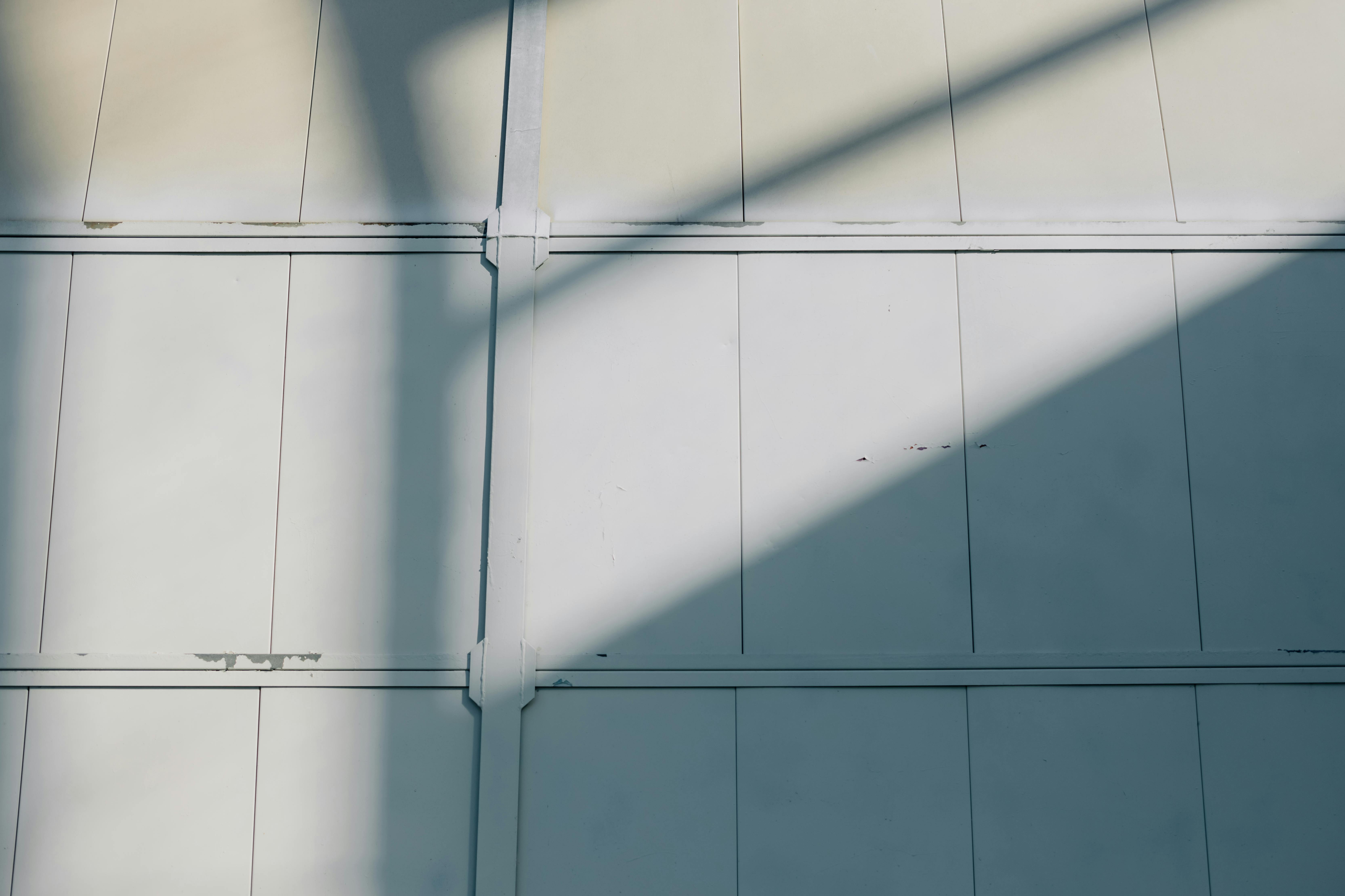 Shadows on White Wall · Free Stock Photo