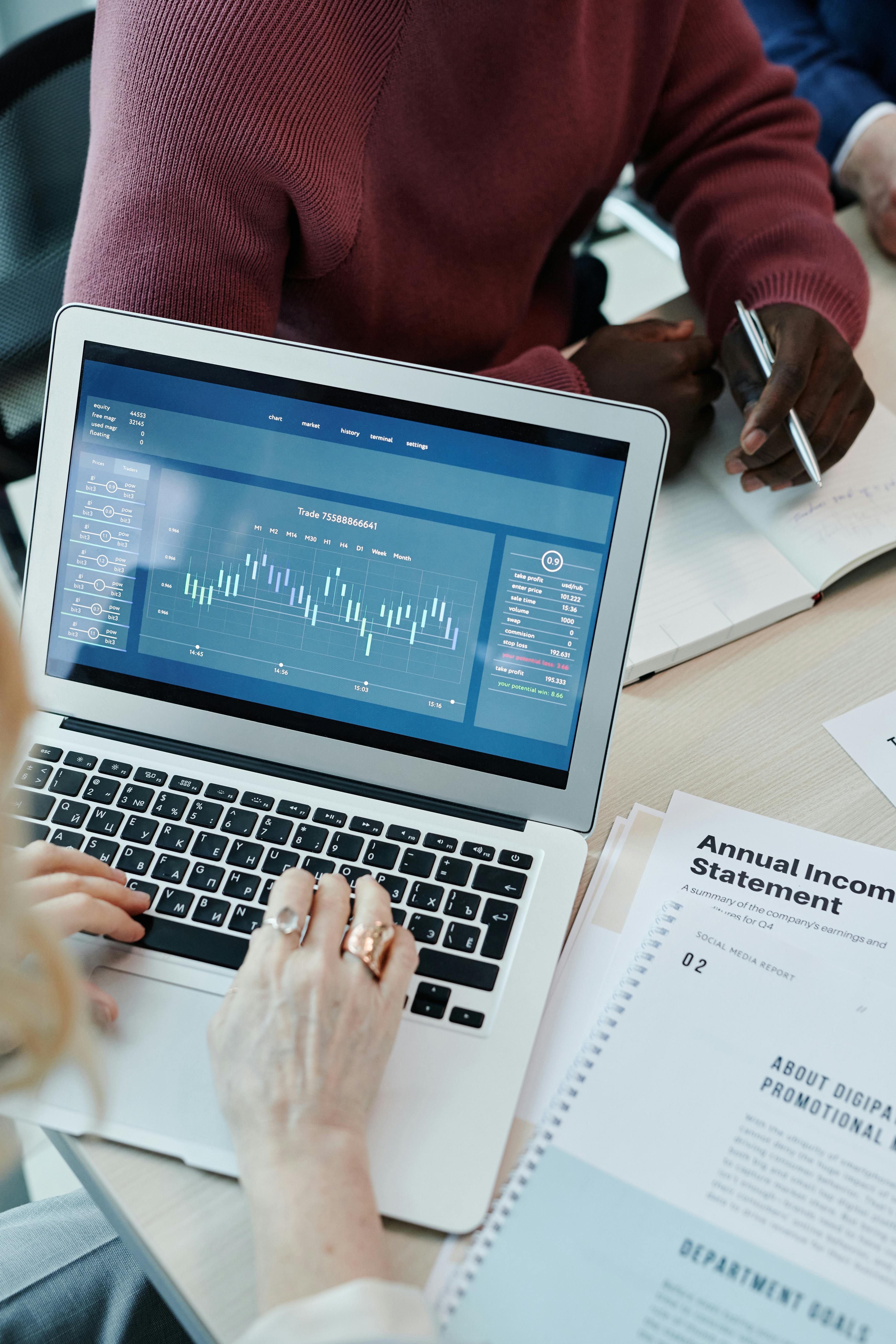 Person Using Laptop on Brown Wooden Table · Free Stock Photo