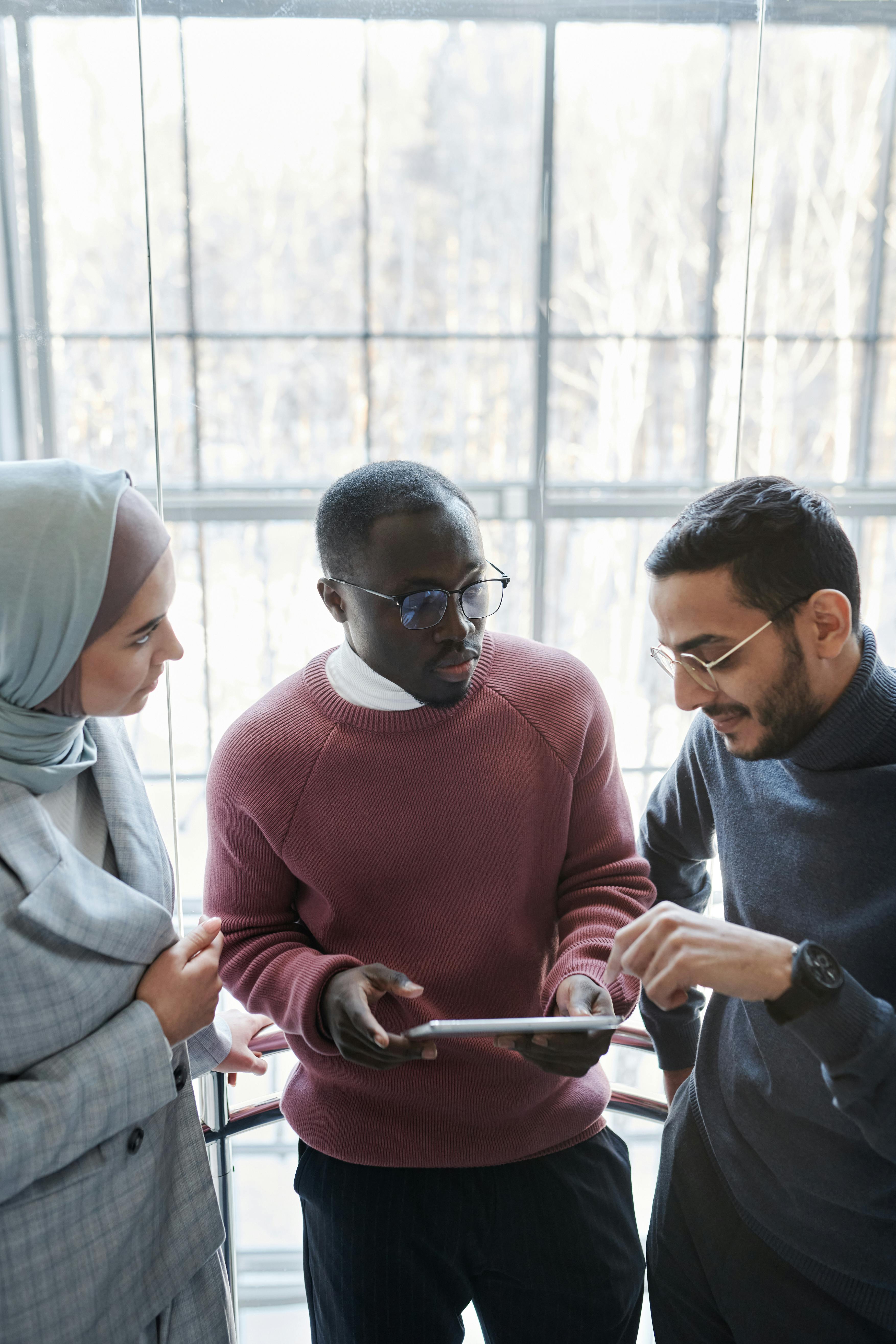 Coworkers Having a Conversation · Free Stock Photo