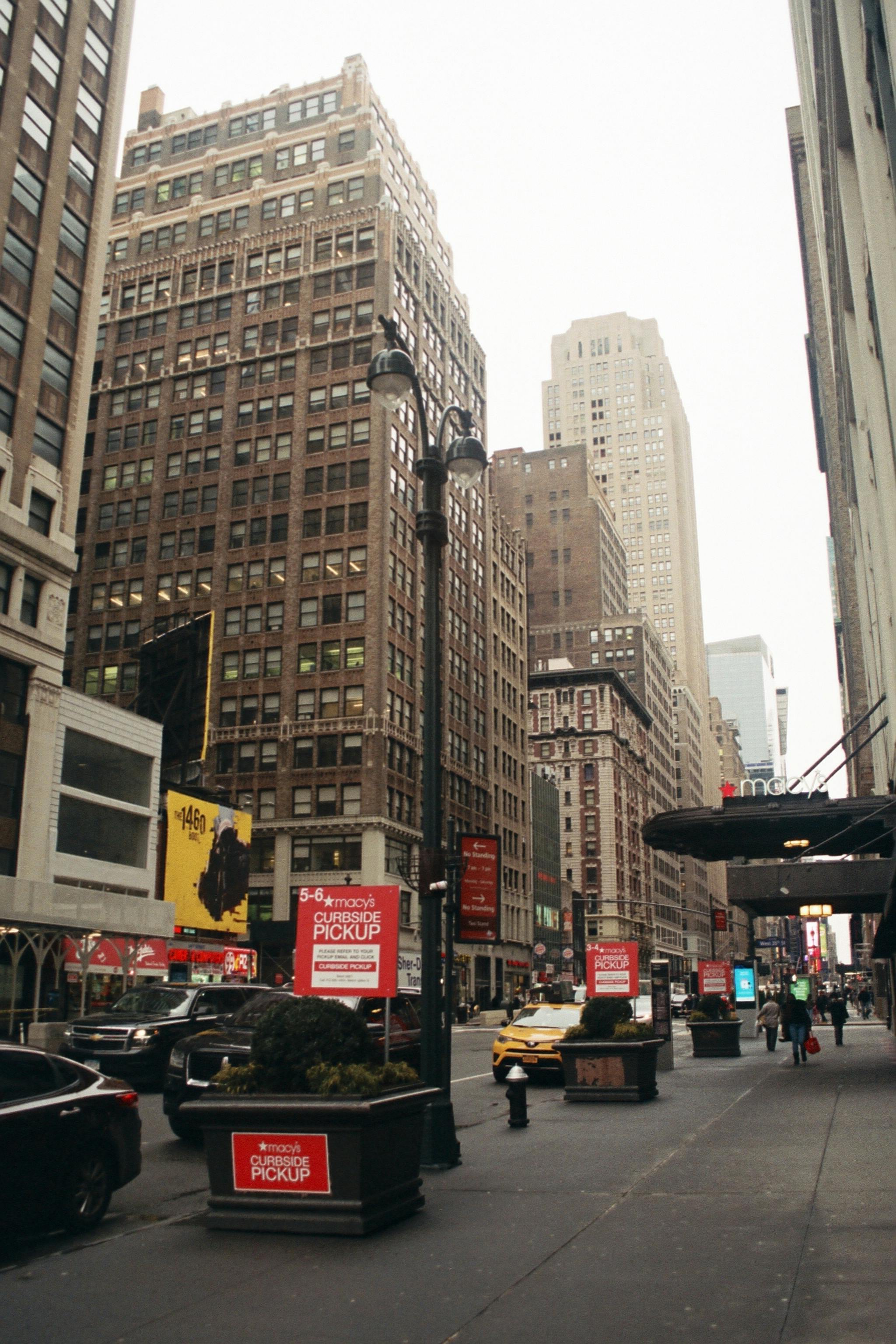 Urban street with narrow asphalt road and old buildings · Free Stock Photo