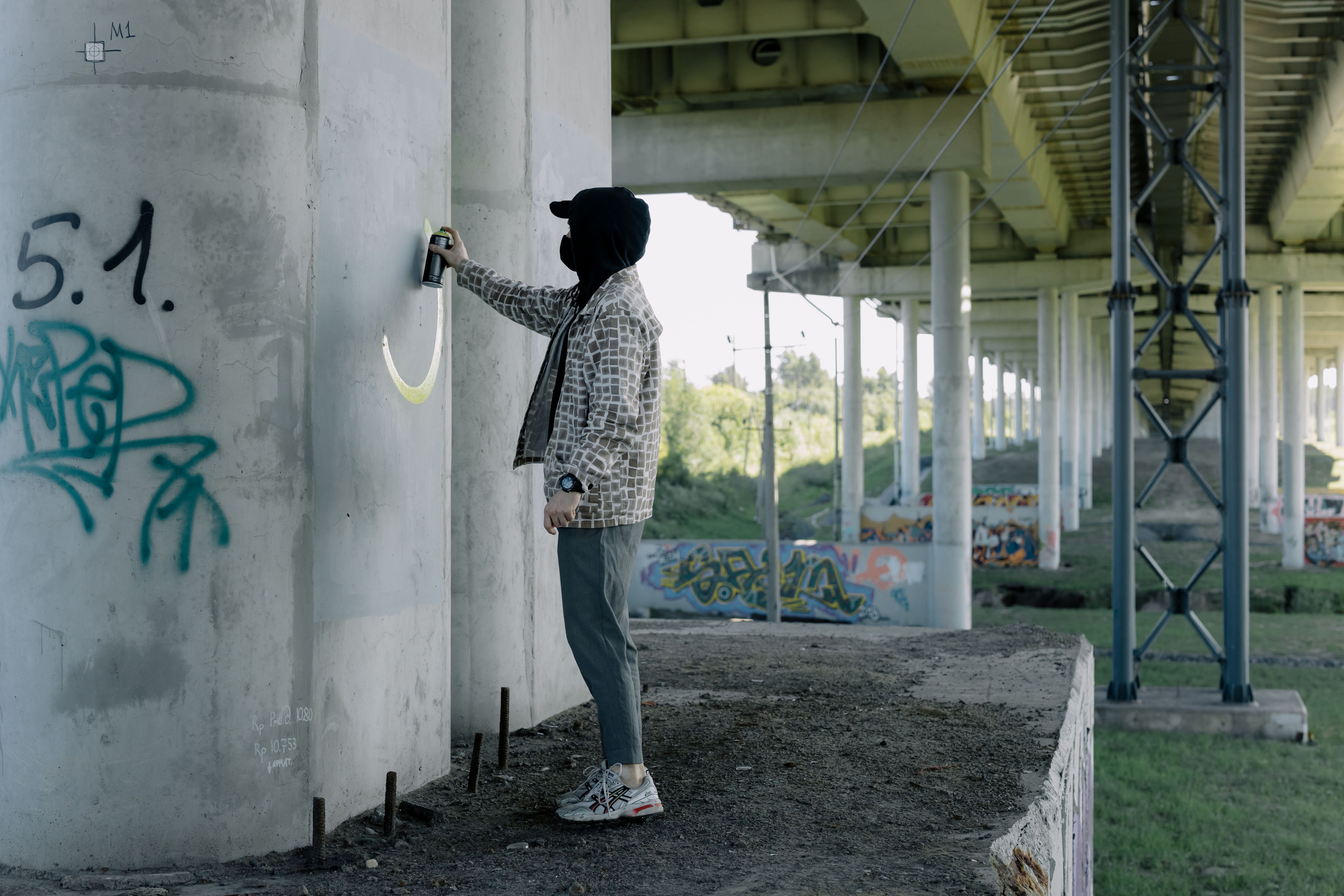 A Person Painting under the Bridge · Free Stock Photo
