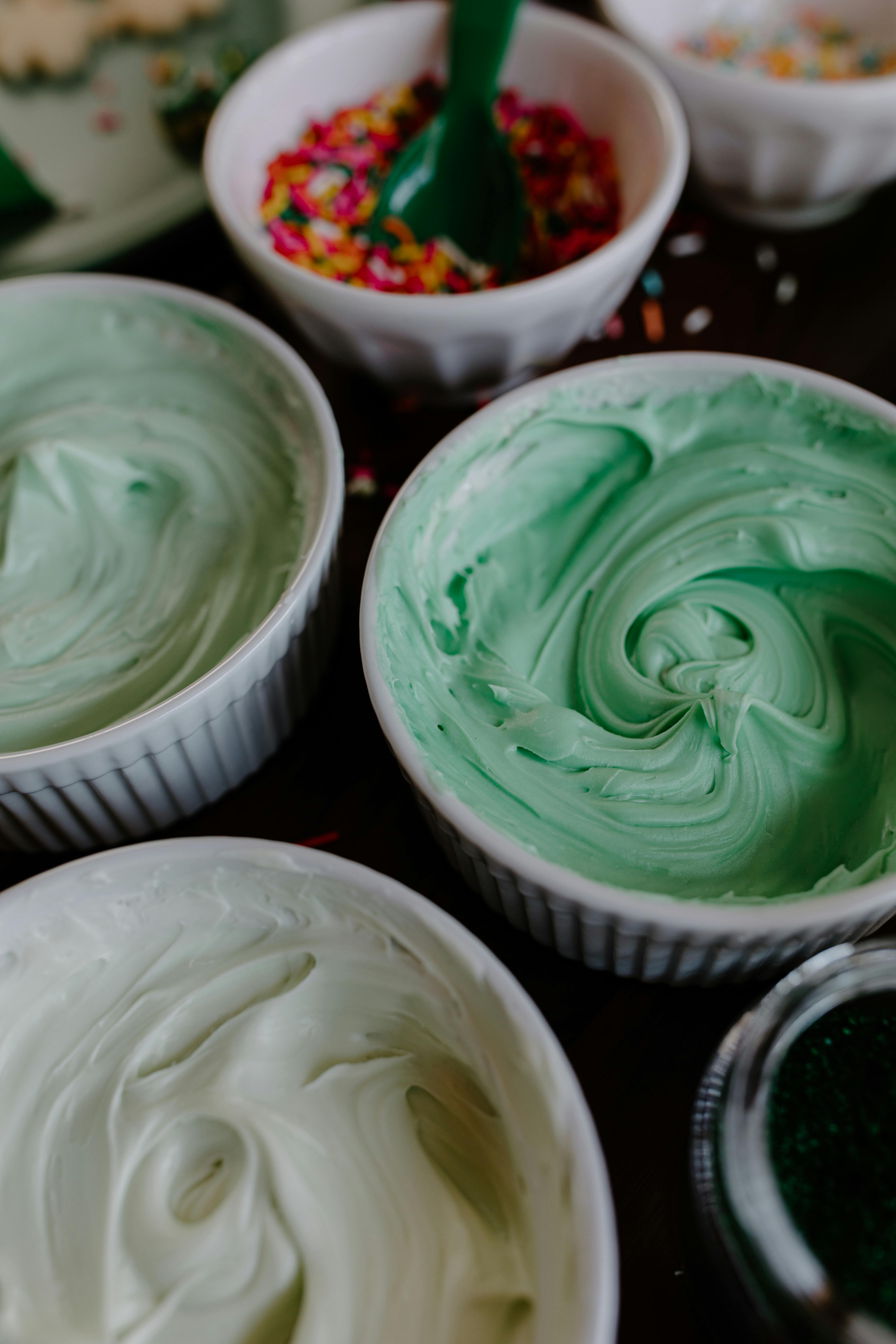 White and Green Icing in Ceramic Bowls · Free Stock Photo