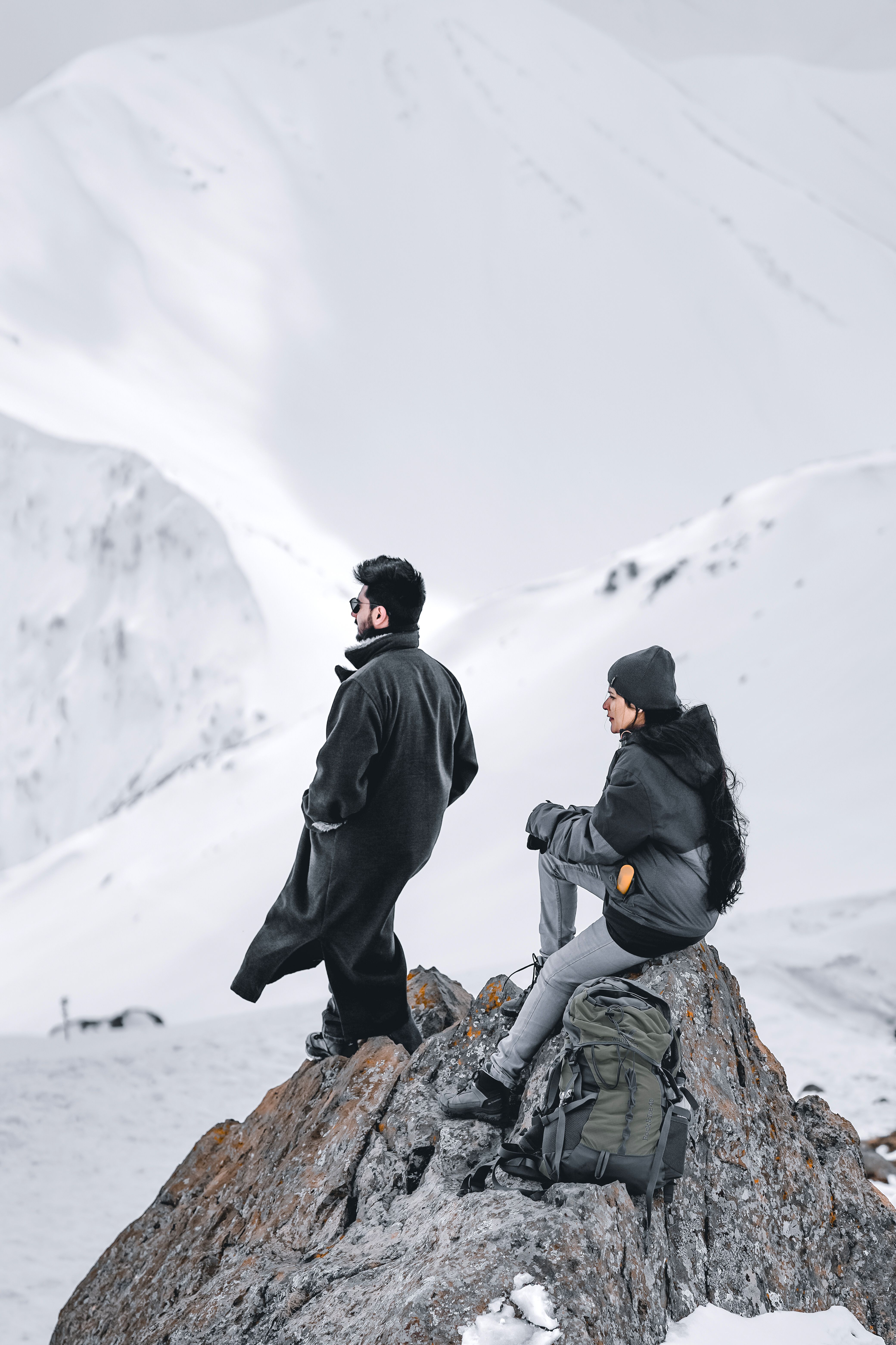Two People on the Rock during Snow · Free Stock Photo