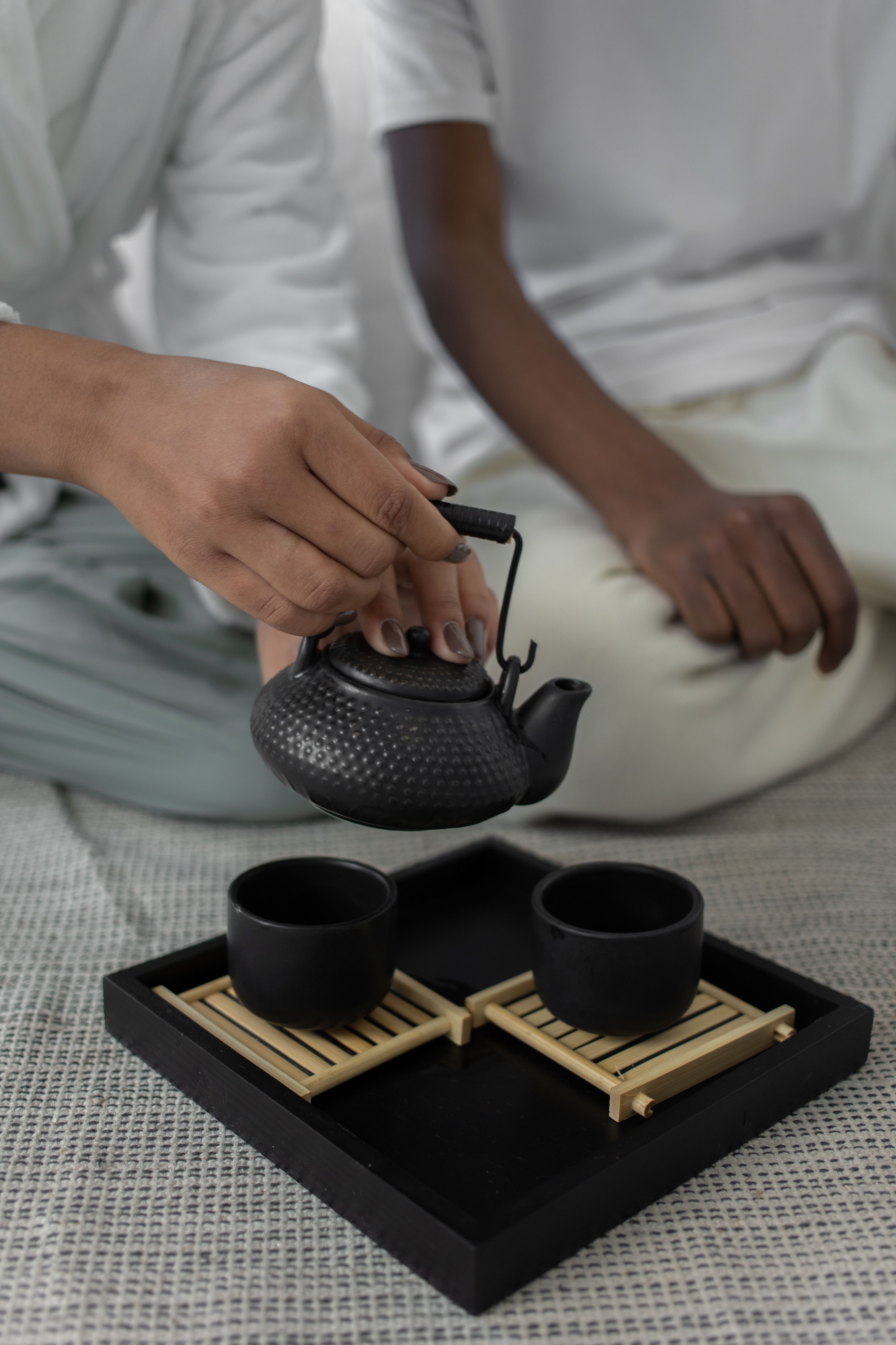 A Person Holding a Teapot · Free Stock Photo