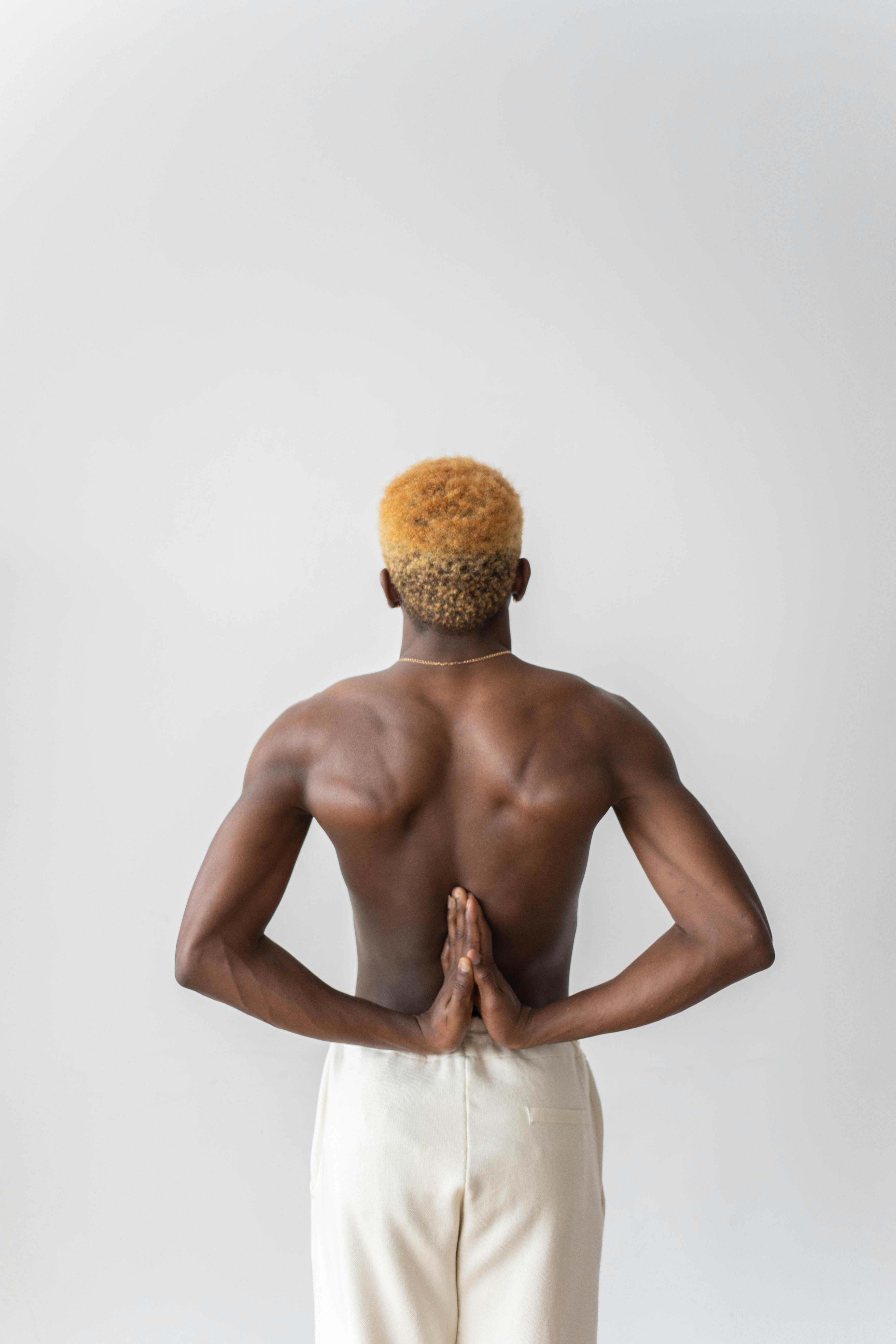 Fit black woman in activewear doing Figure Four · Free Stock Photo