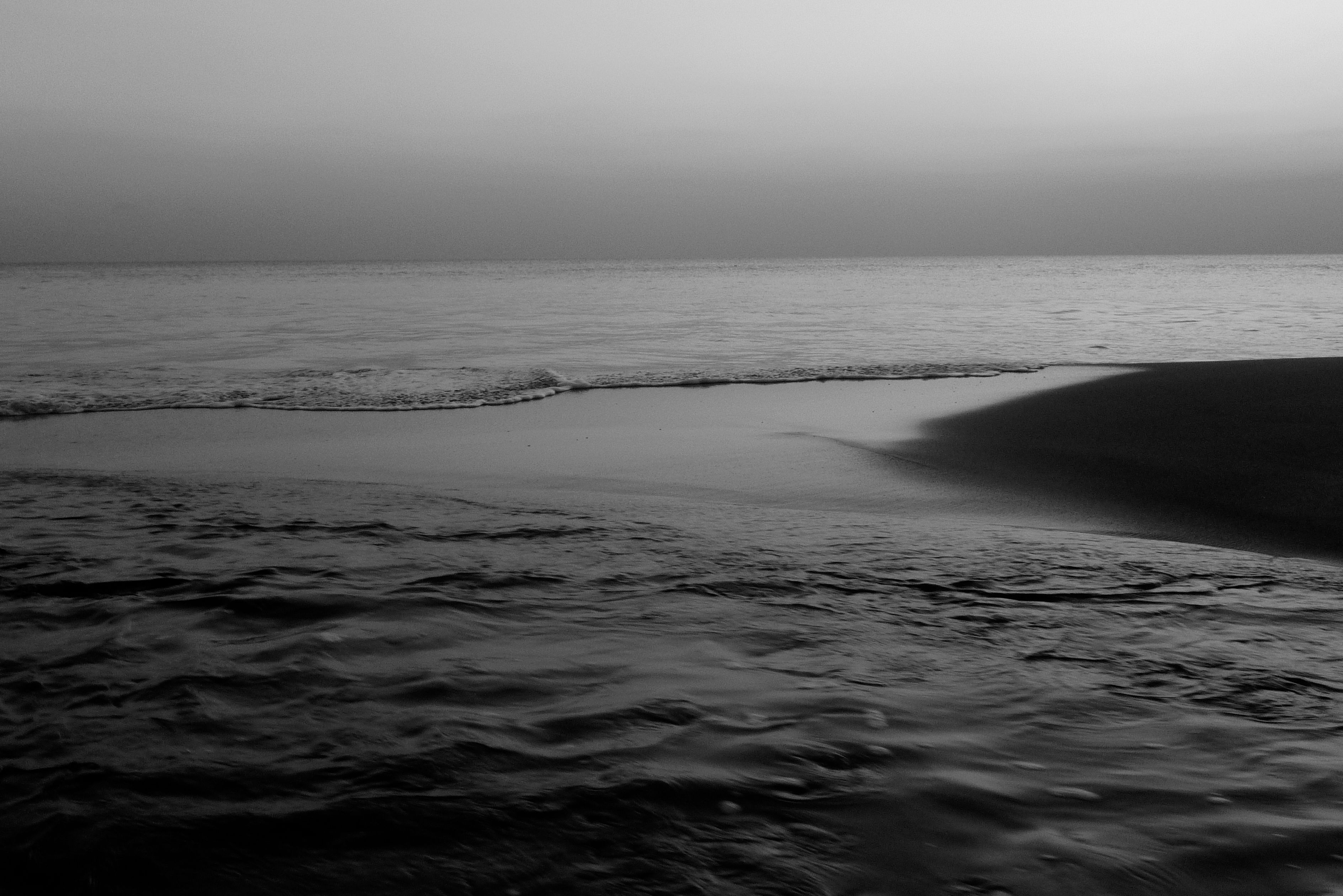 Grayscale Photo of the Beach · Free Stock Photo