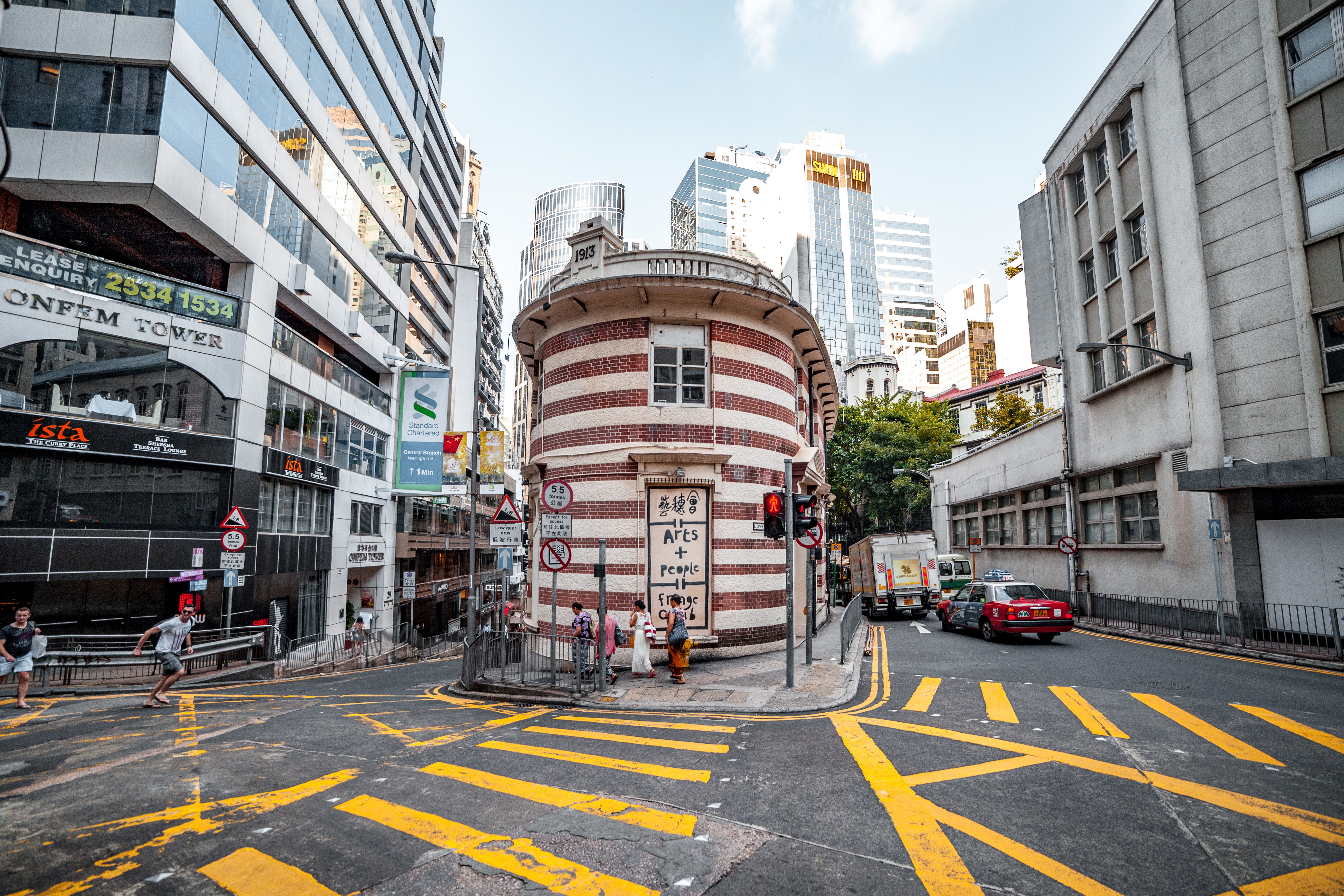 Building at a Zebra Crossing on a Road Intersection · Free Stock Photo