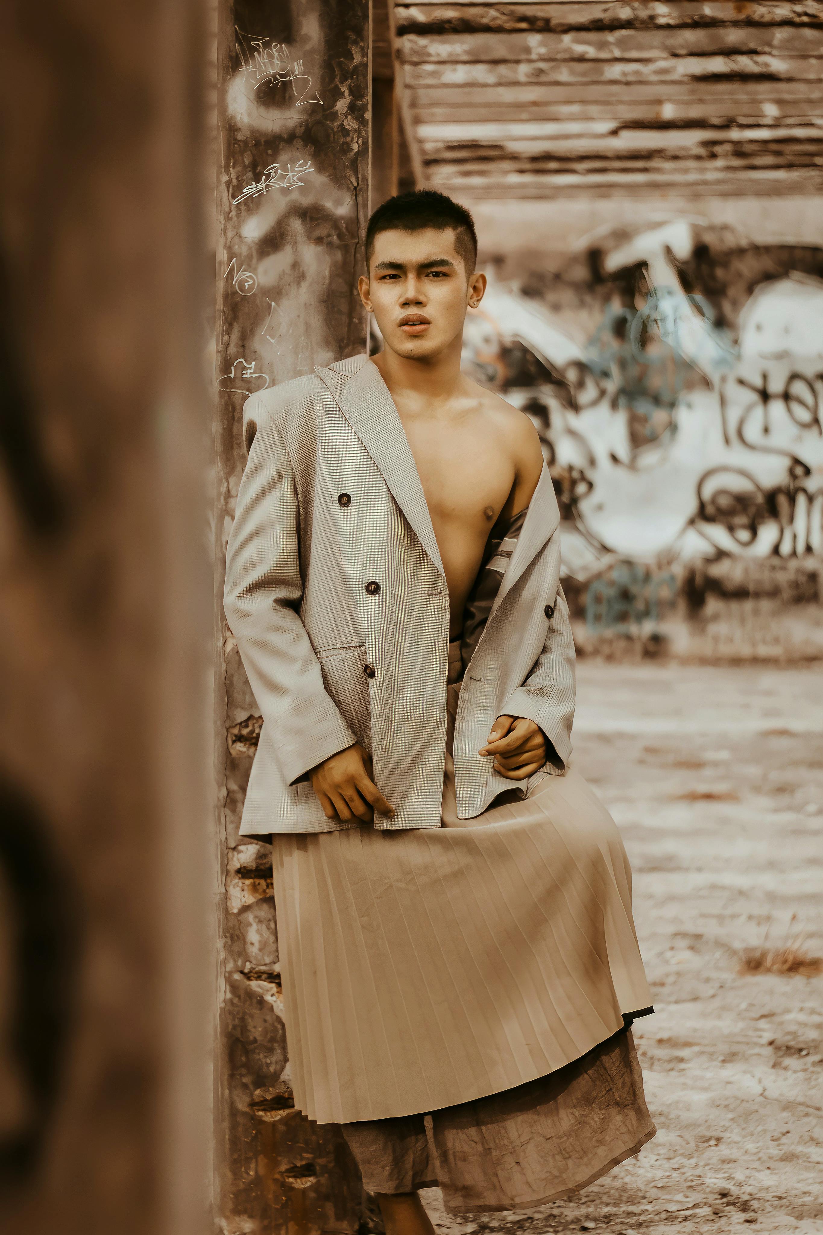 Stylish Asian man standing in field · Free Stock Photo