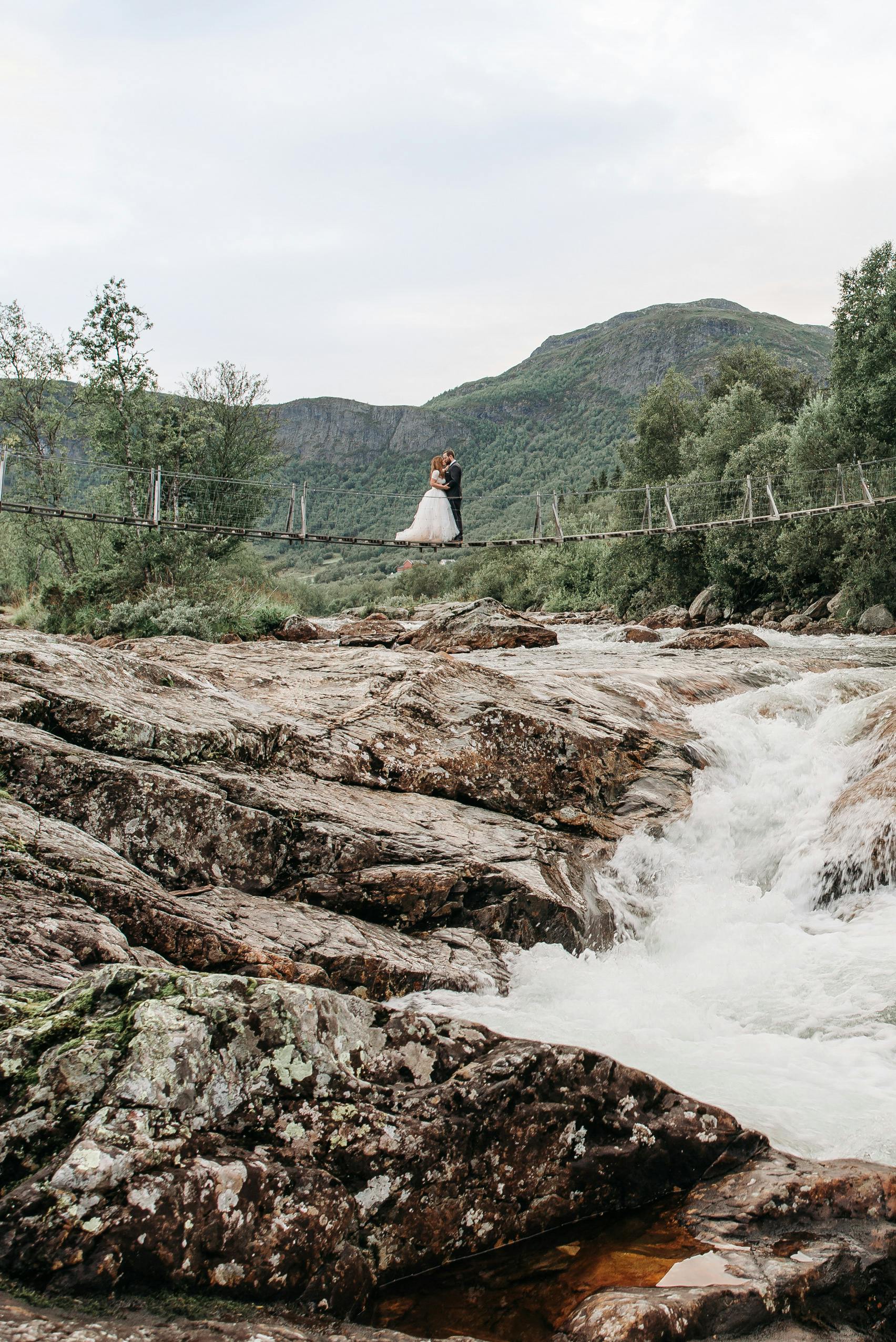 Wobbly Bridge Over A River With A Waterfall Photos, Download The BEST ...