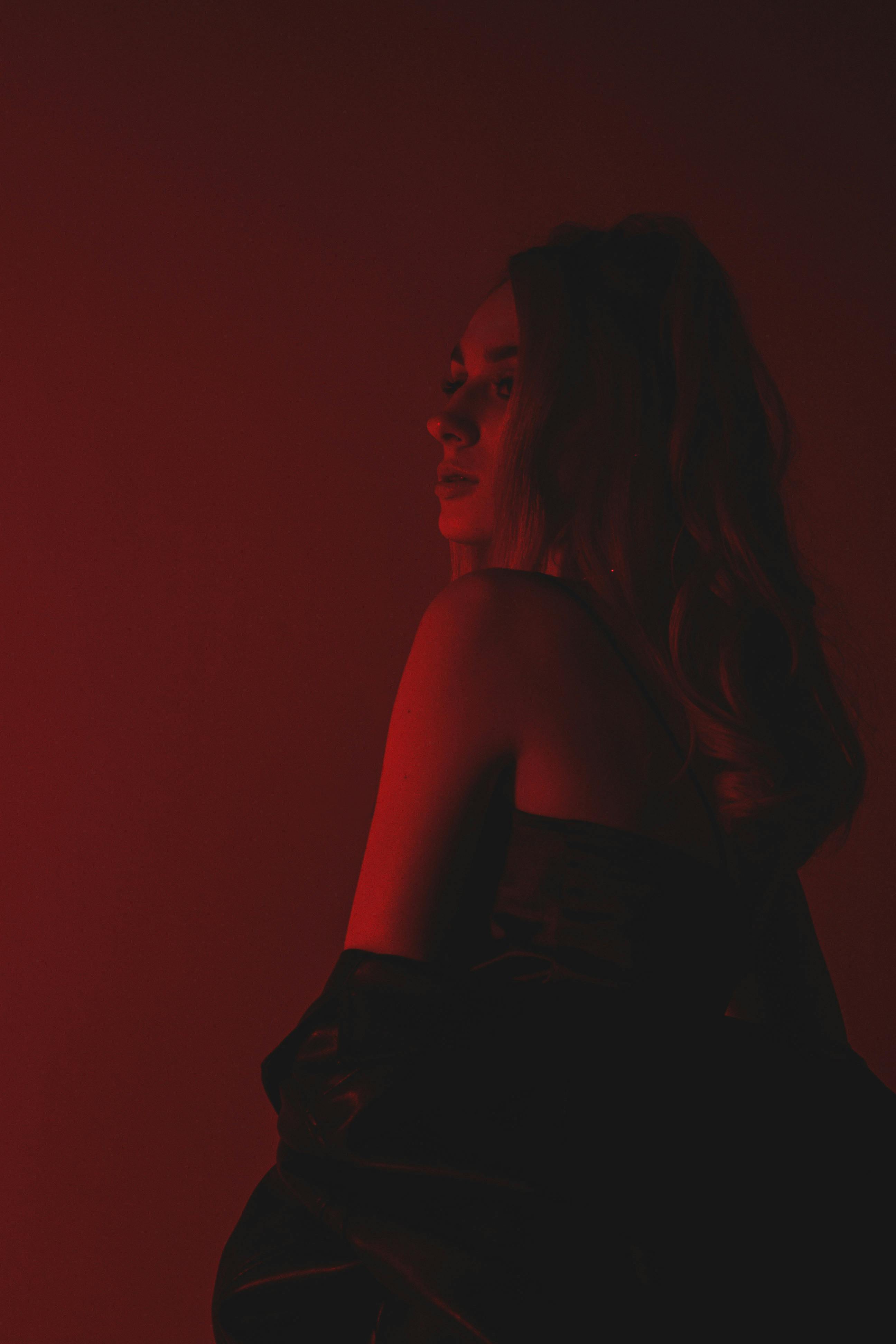 Portrait of a Woman Looking over her Shoulder · Free Stock Photo