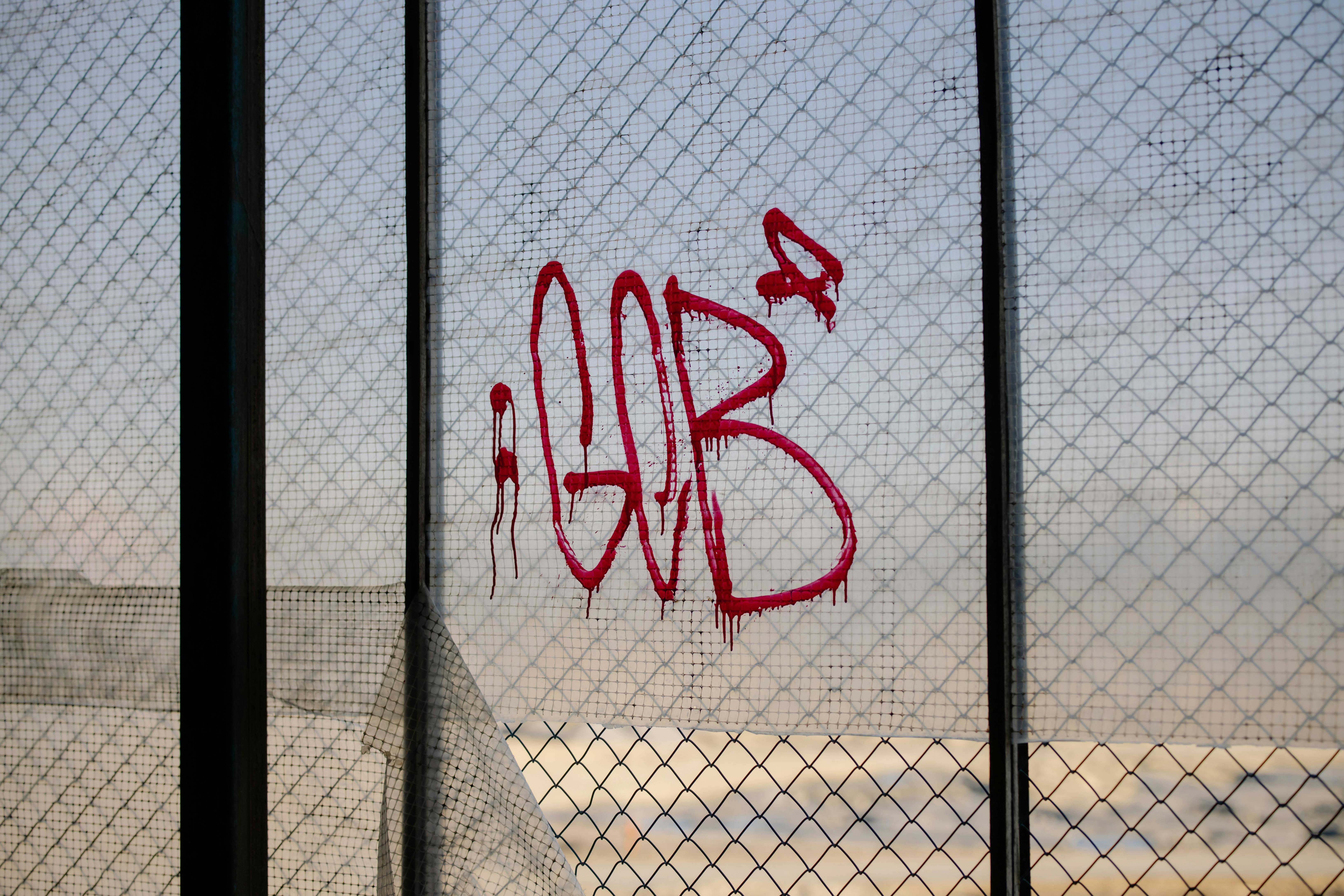 Graffiti Tag on Window Pane · Free Stock Photo