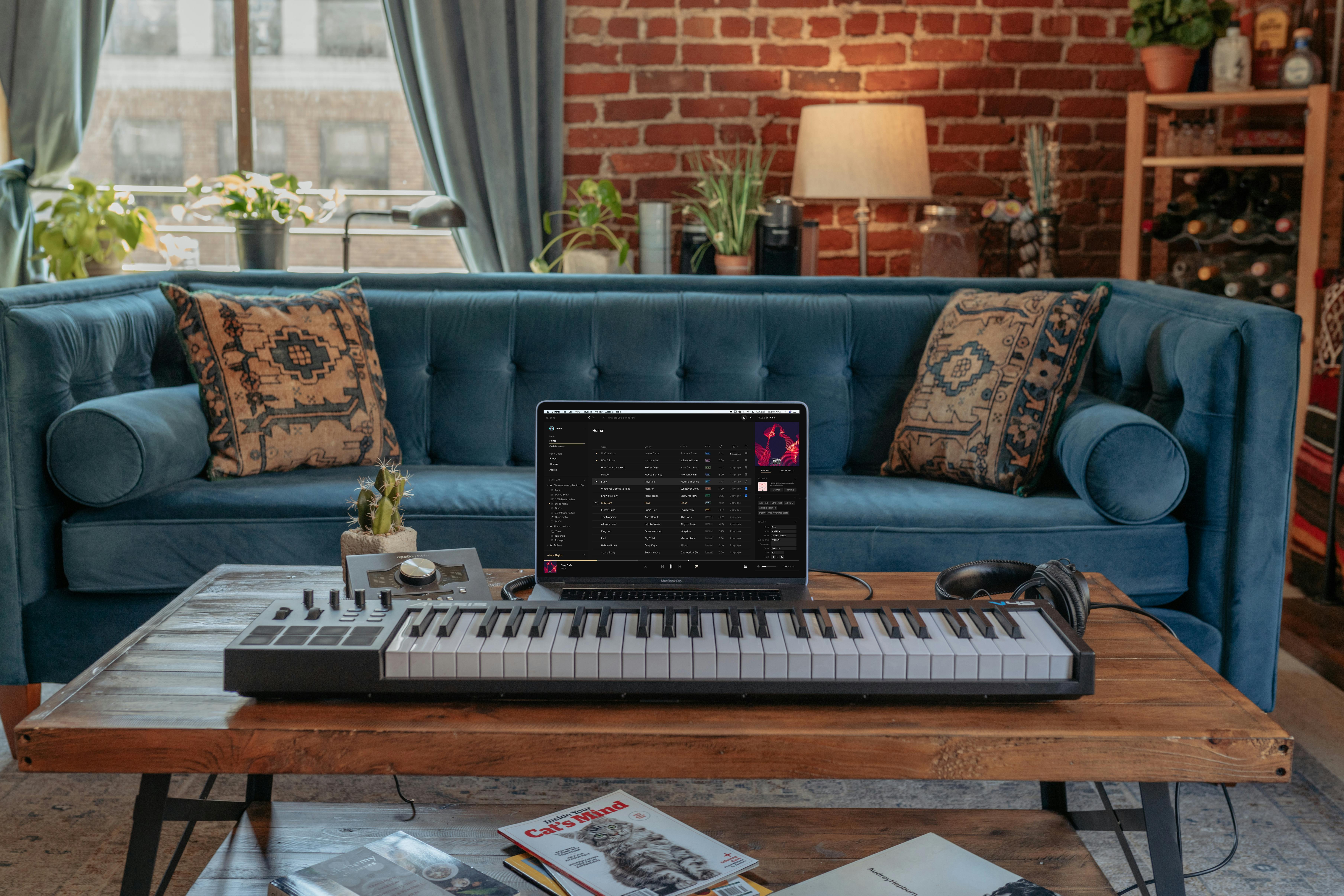 A MIDI Controller and a Laptop on a Wooden Table · Free Stock Photo