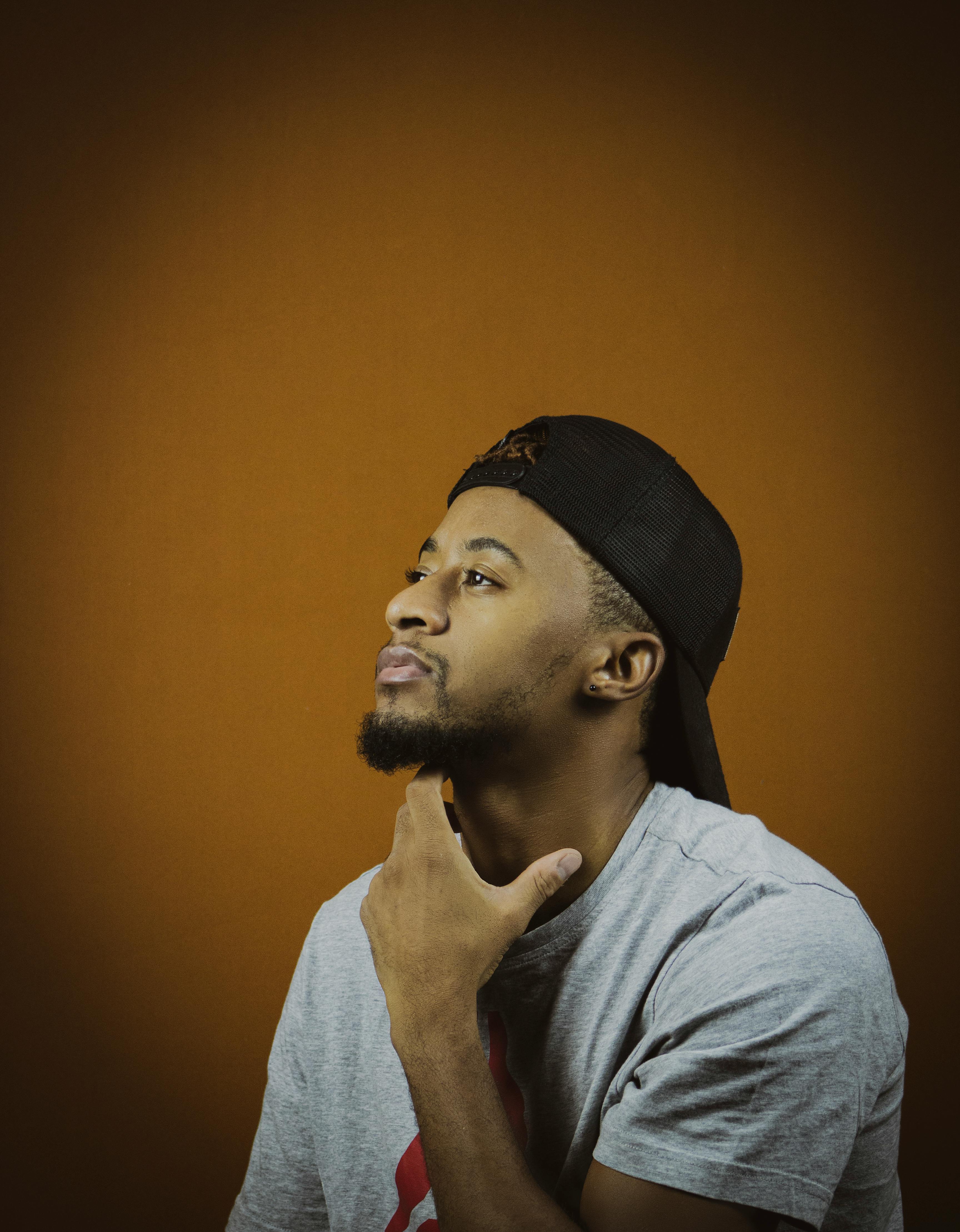 Grayscale Photo of Man Wearing Snapback Cap · Free Stock Photo