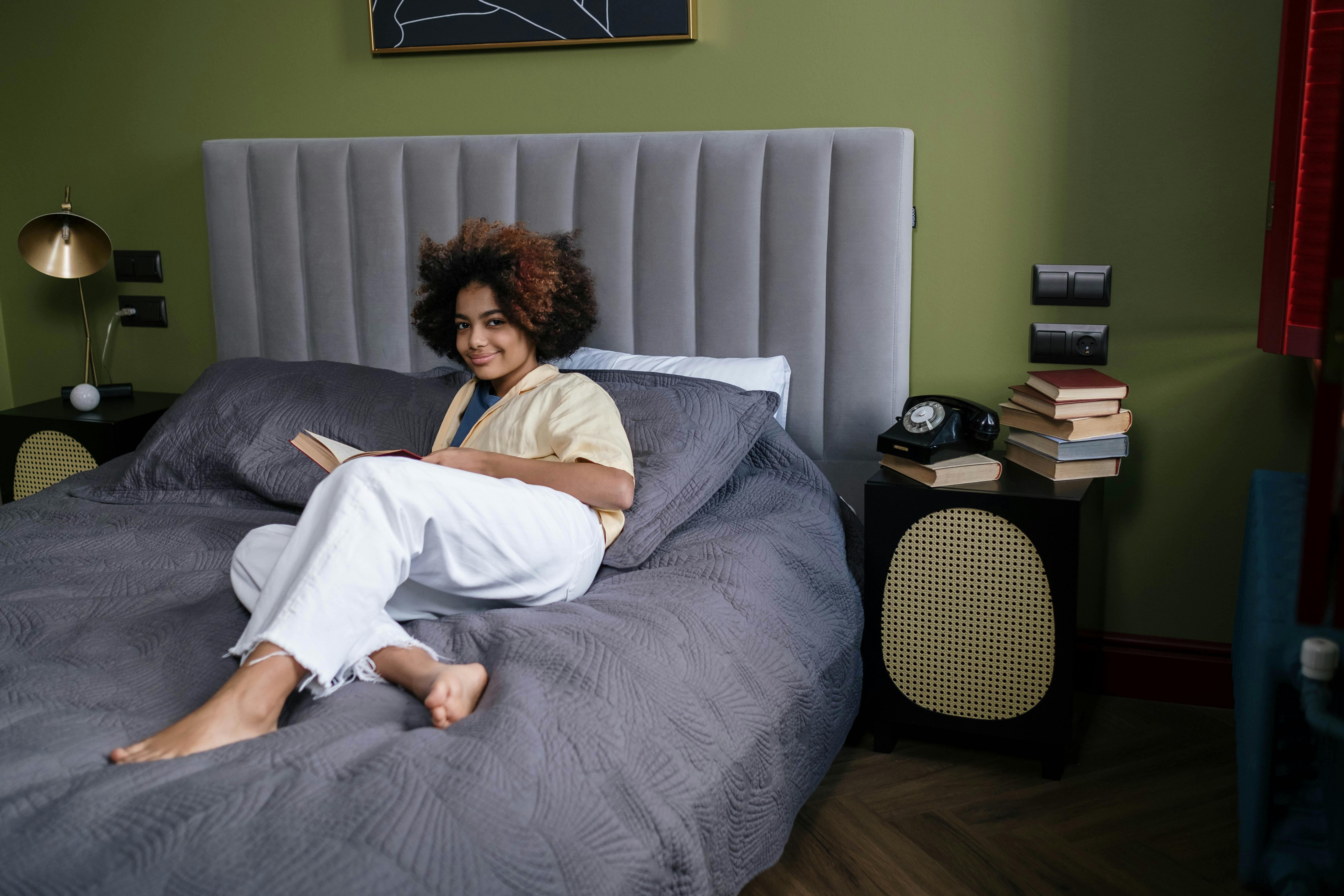 Woman Lying on Bed With Green Leaves · Free Stock Photo