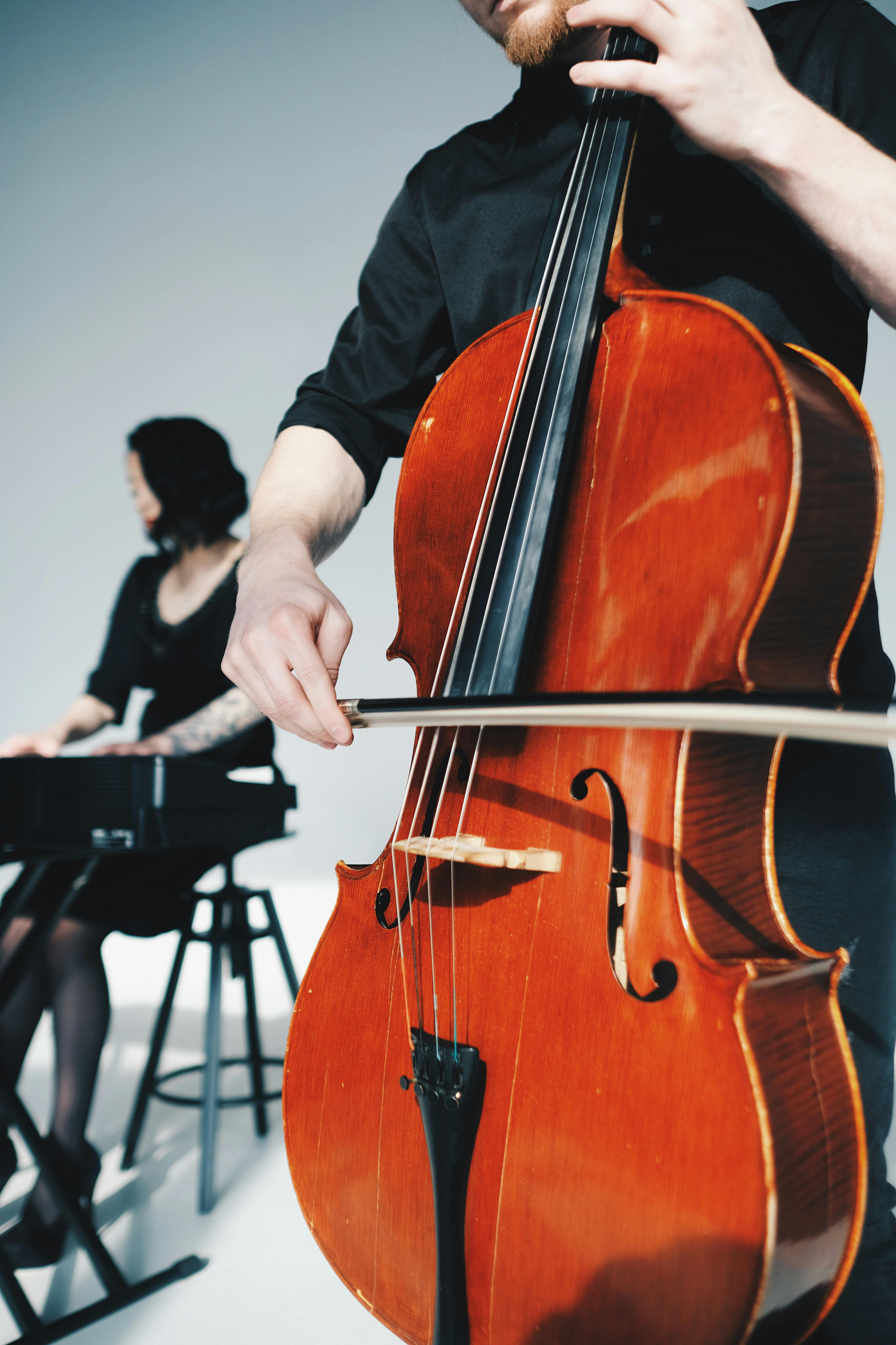 Close-up Photo of Person playing a Cello · Free Stock Photo