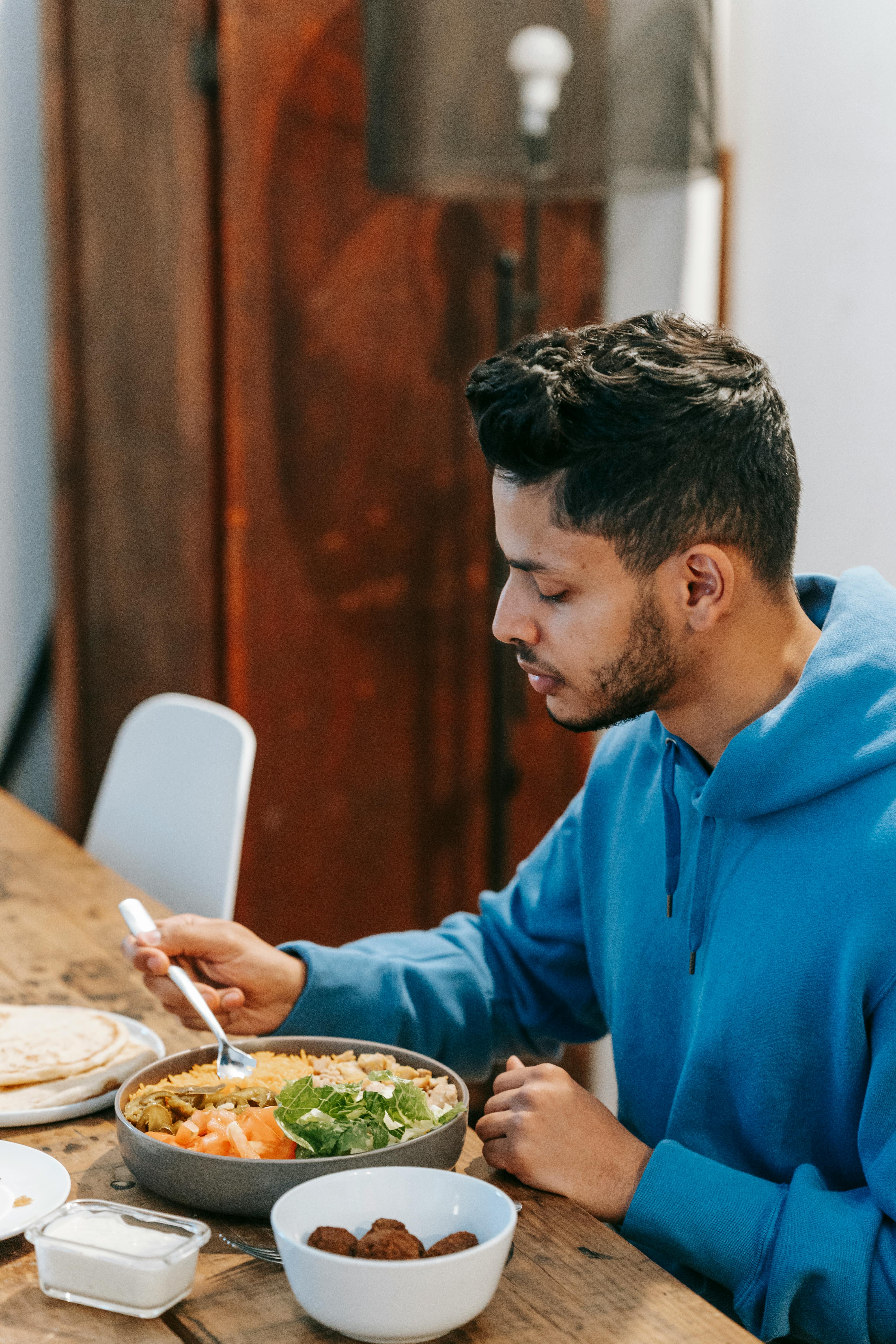 Indian man at table with delicious lunch in house · Free Stock Photo