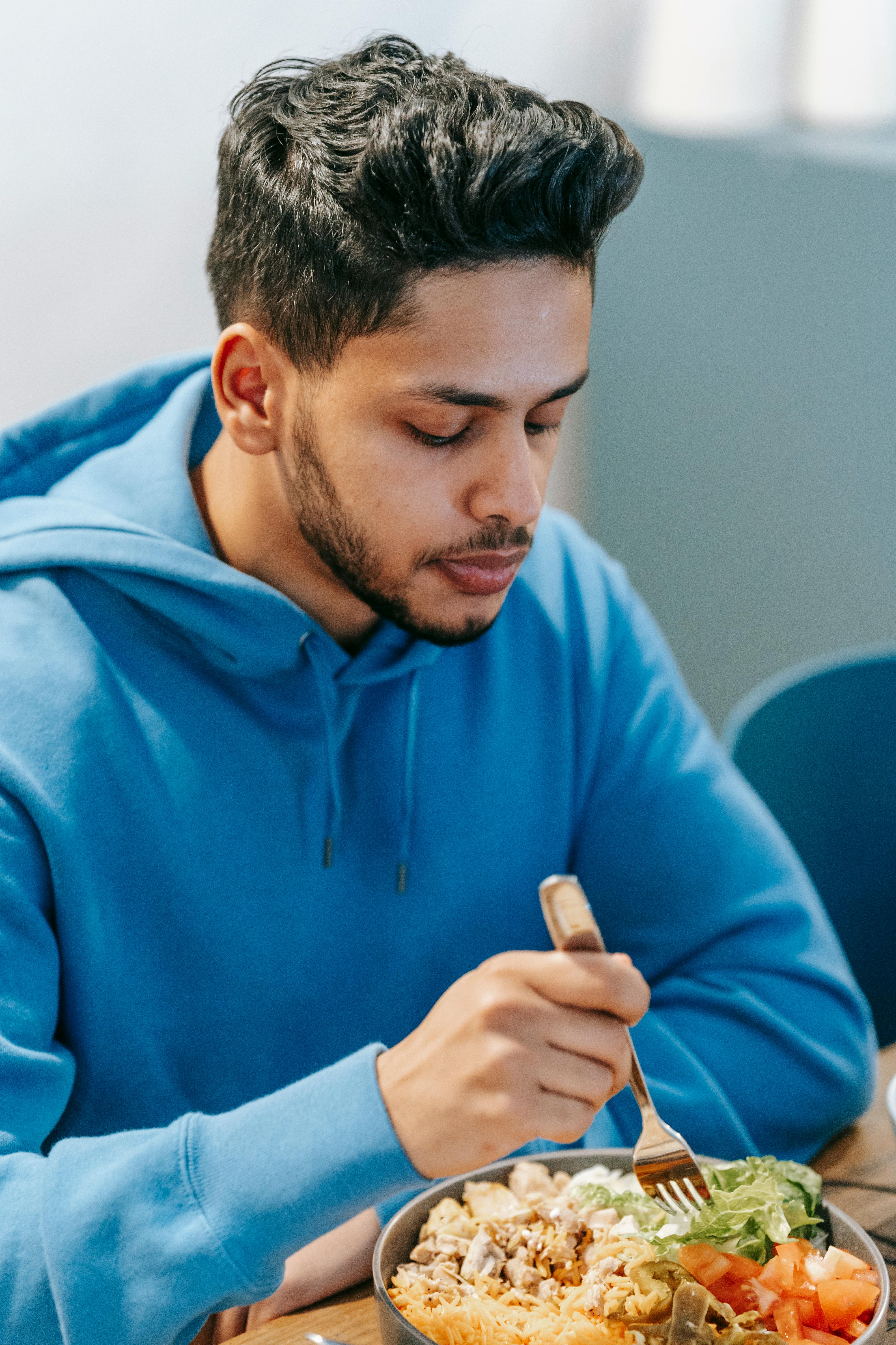 Indian man trying delicious dish with vegetables and meat · Free Stock ...