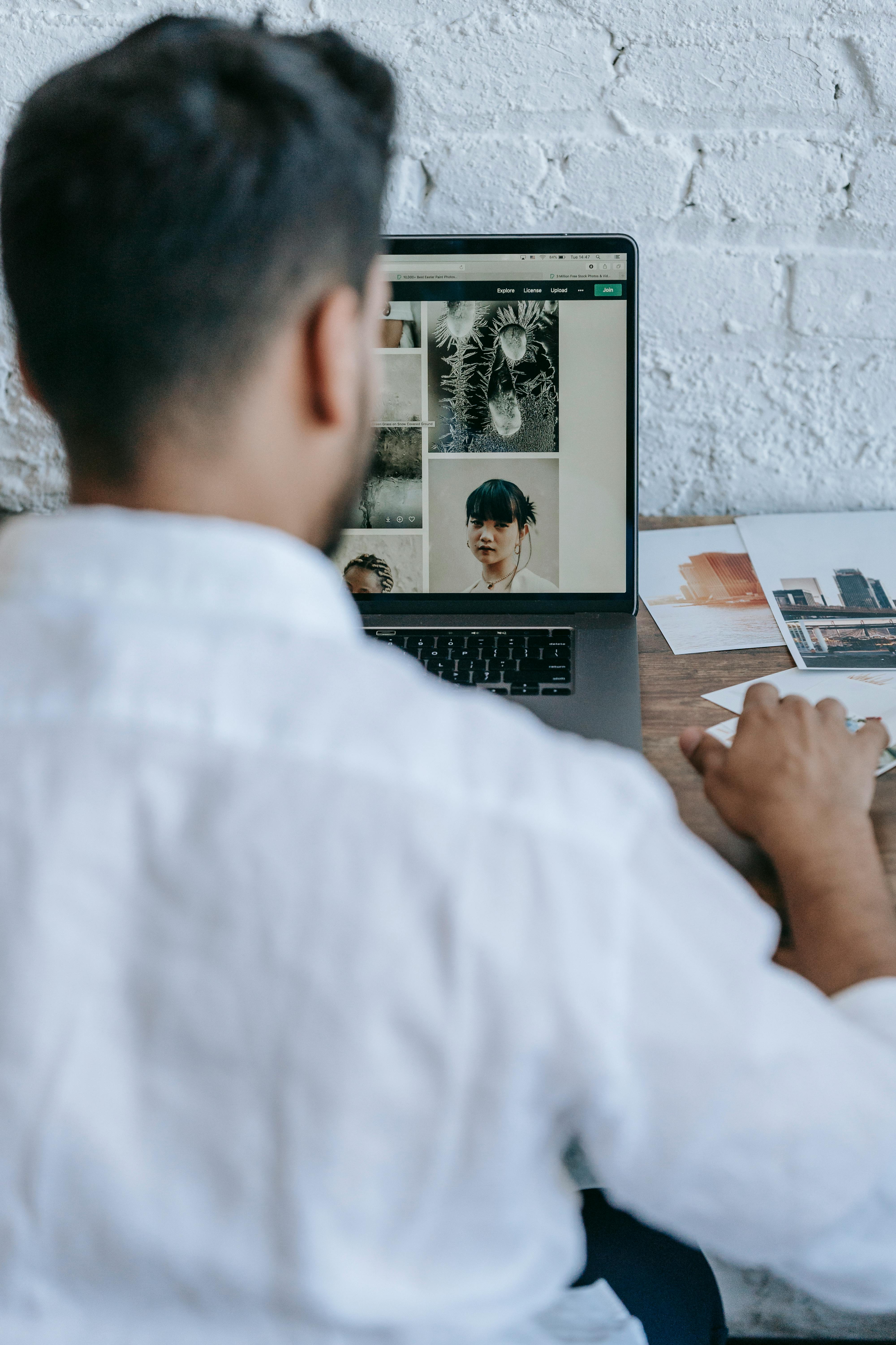 Photo of Person Putting Photo on Wall · Free Stock Photo