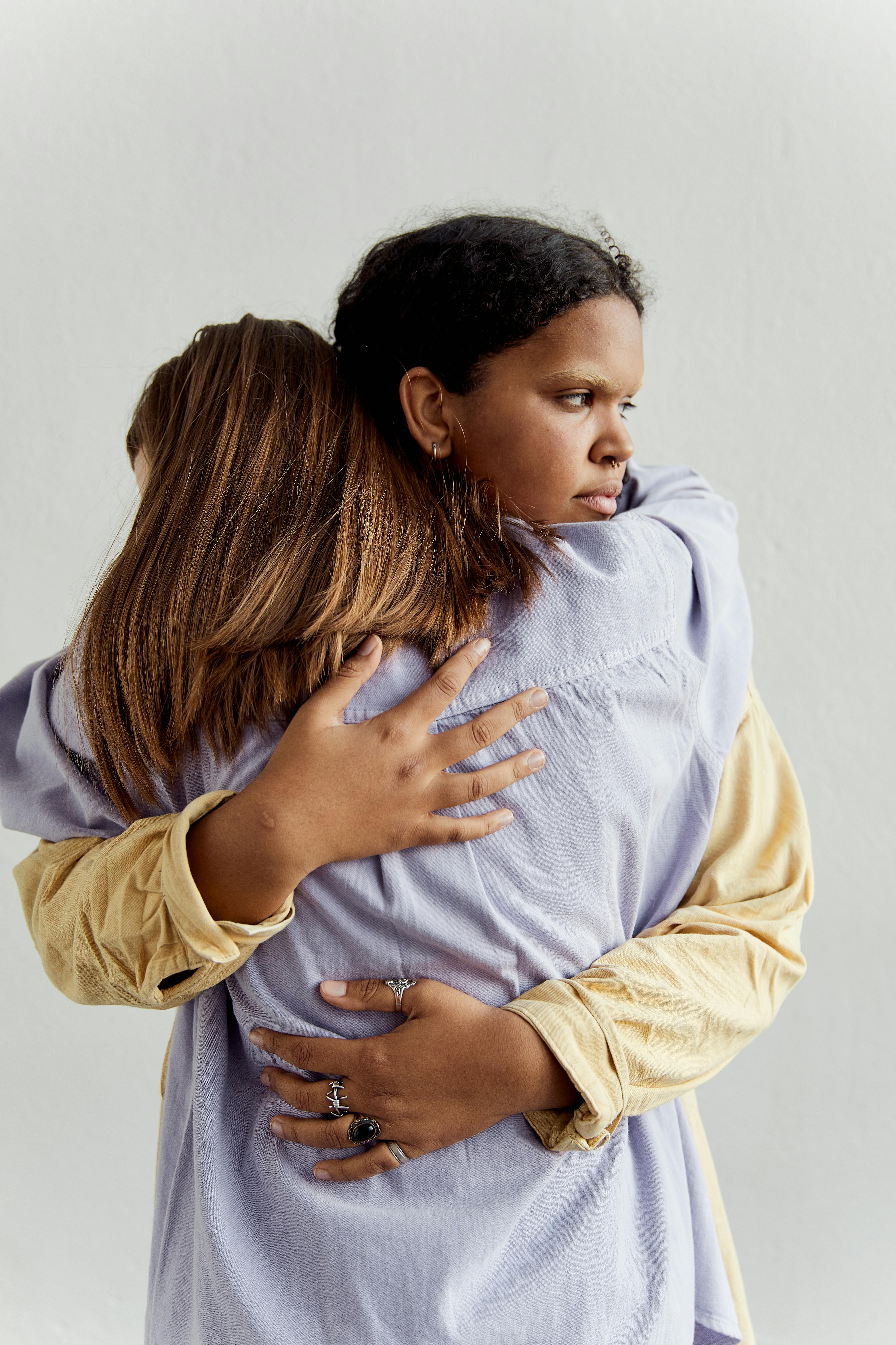 Woman Embracing another Person wit Empathy · Free Stock Photo