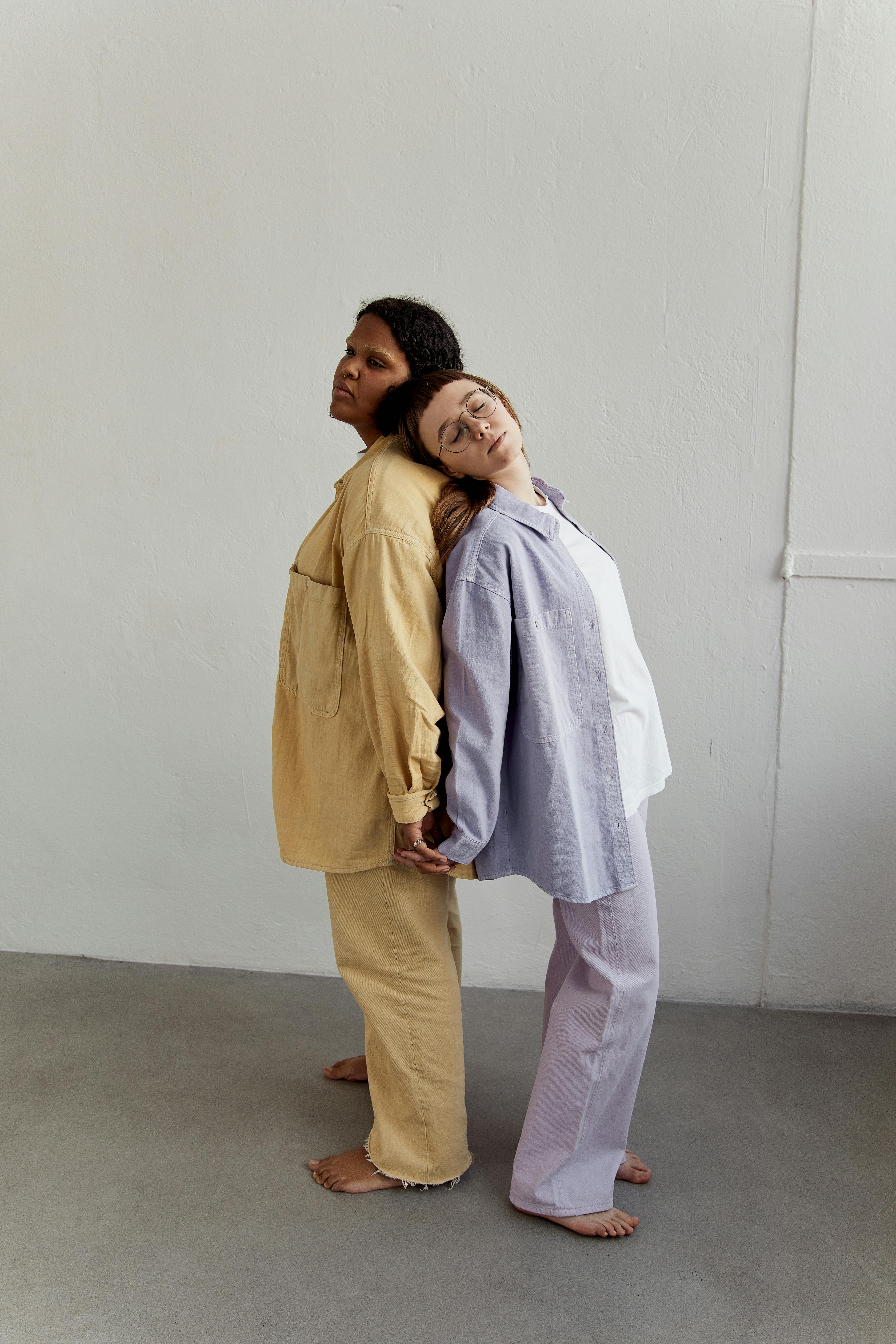 Photo of Girls Posing Back to Back · Free Stock Photo