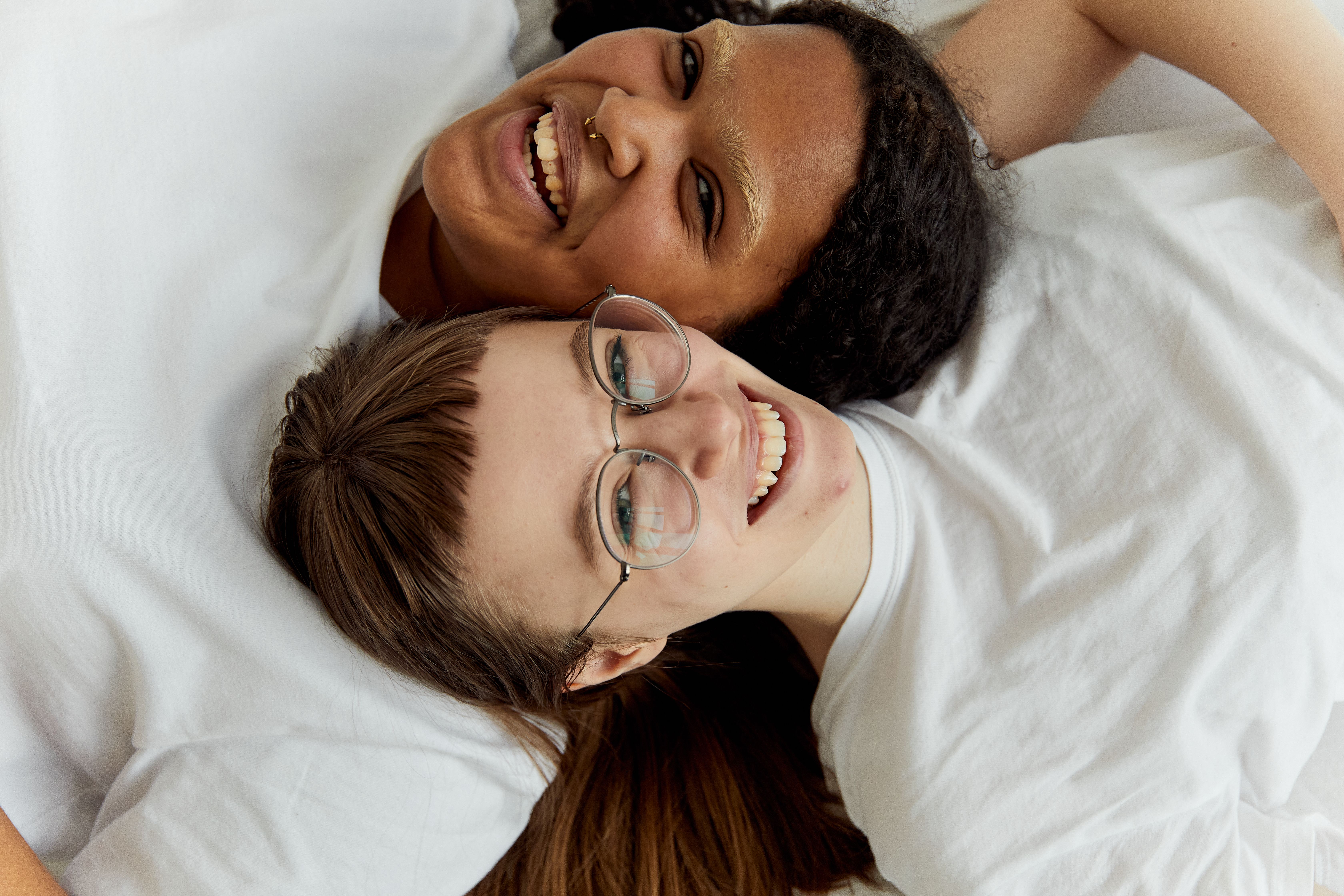 Low-Angle Shot of a Romantic Couple in White Shirts · Free Stock Photo