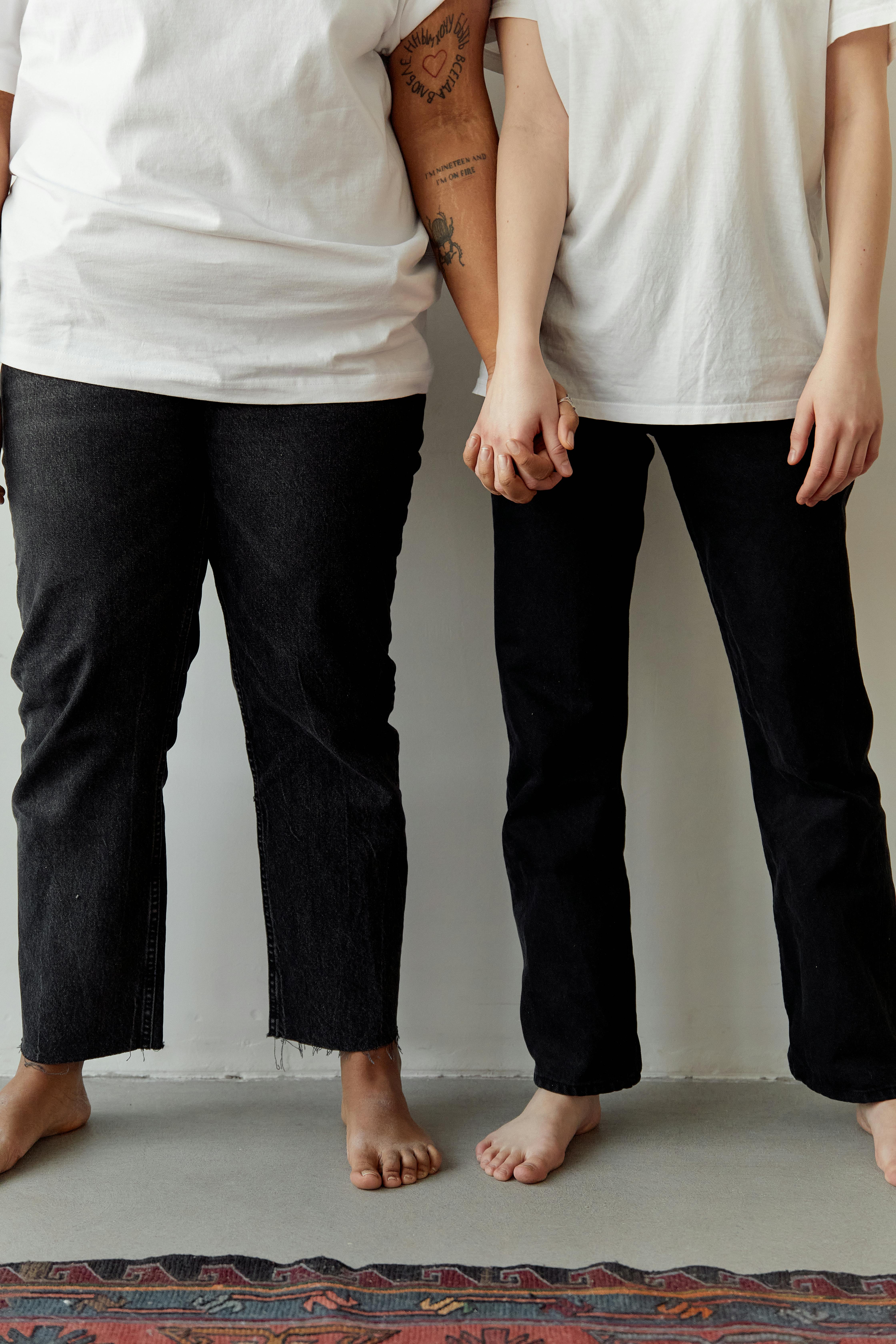 Two People Barefooted Holding Hands · Free Stock Photo