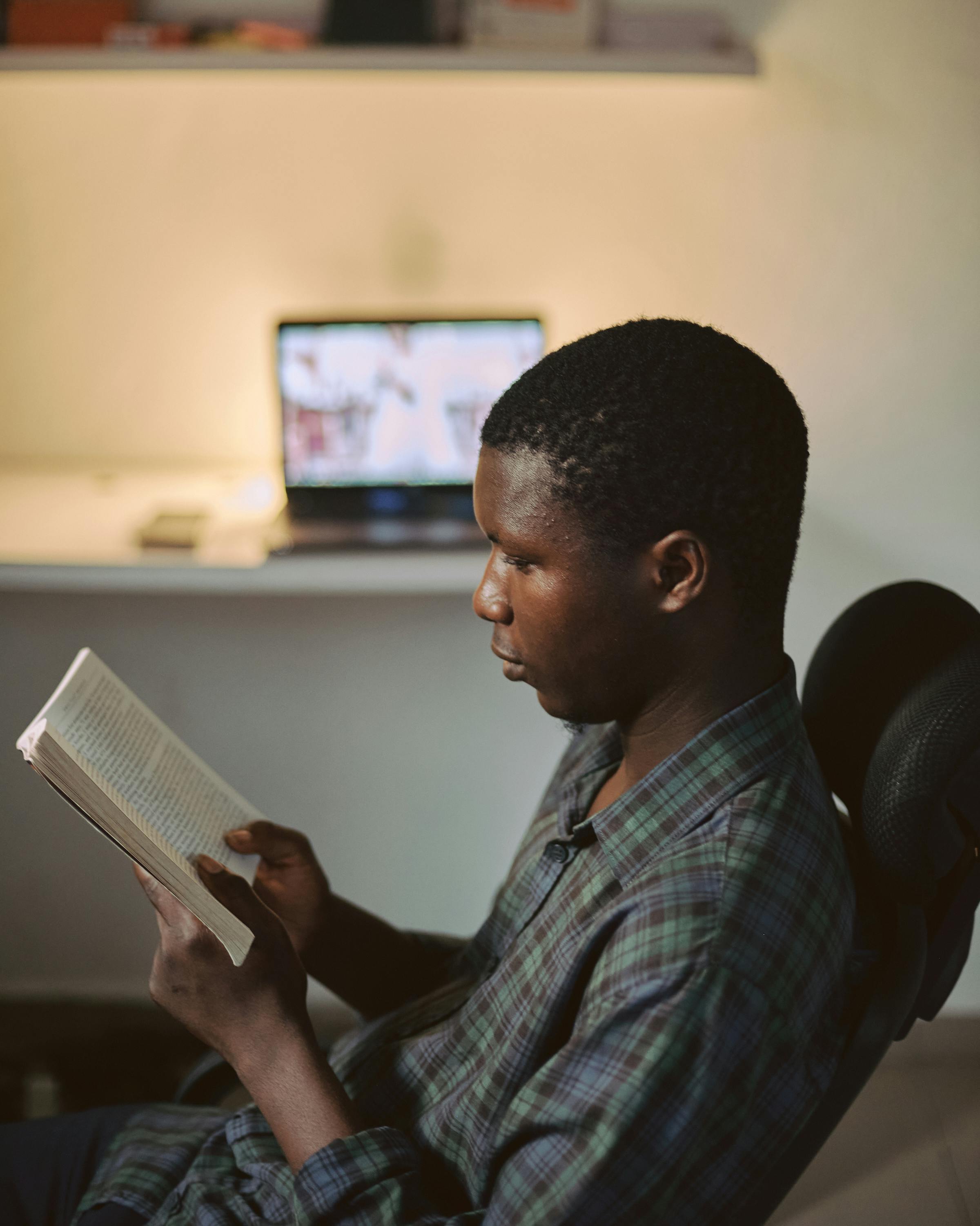 Man Reading Book in Field · Free Stock Photo