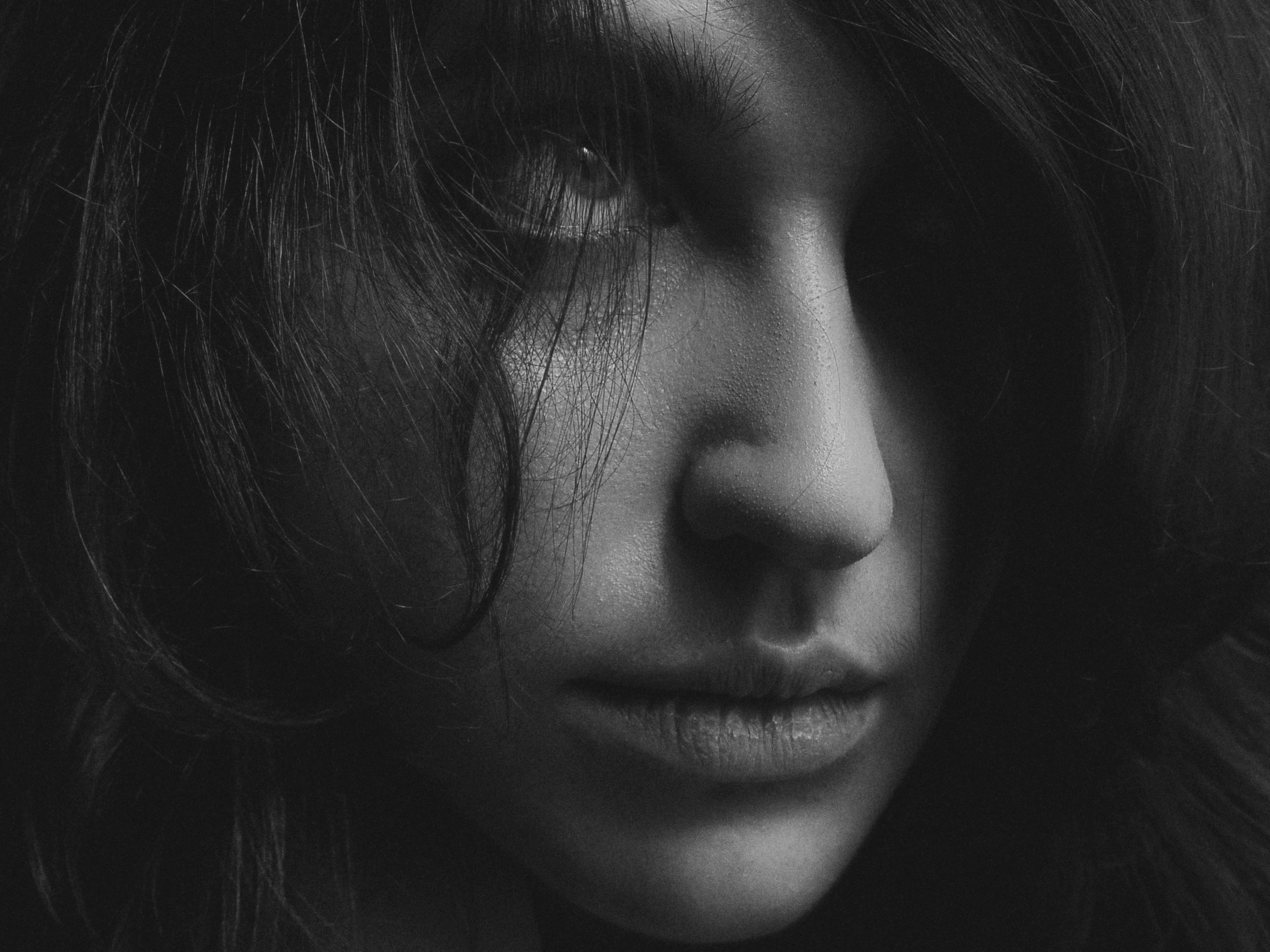 Monochrome Photo of a Woman's Face · Free Stock Photo