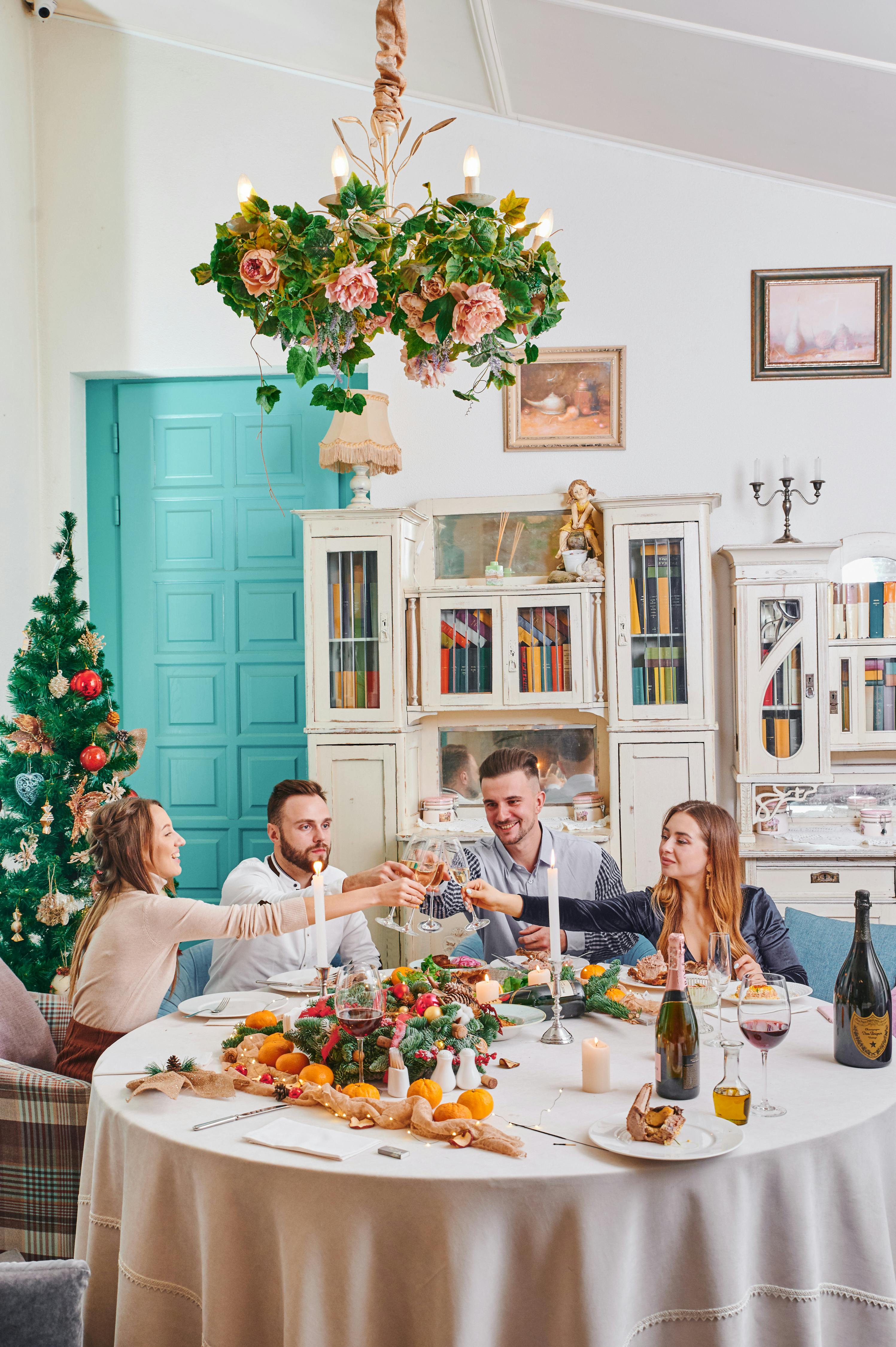 A Family Sitting on the Dining Table Eating · Free Stock Photo