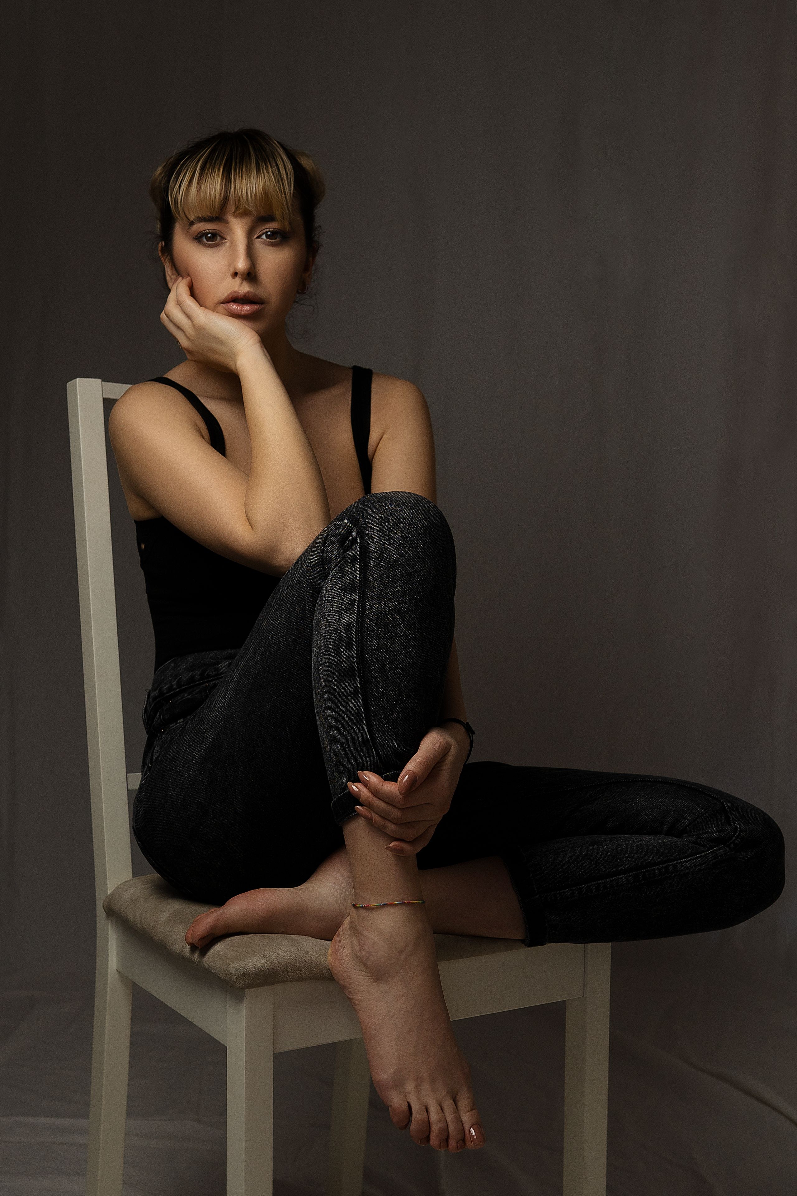 Stylish woman sitting on chair · Free Stock Photo