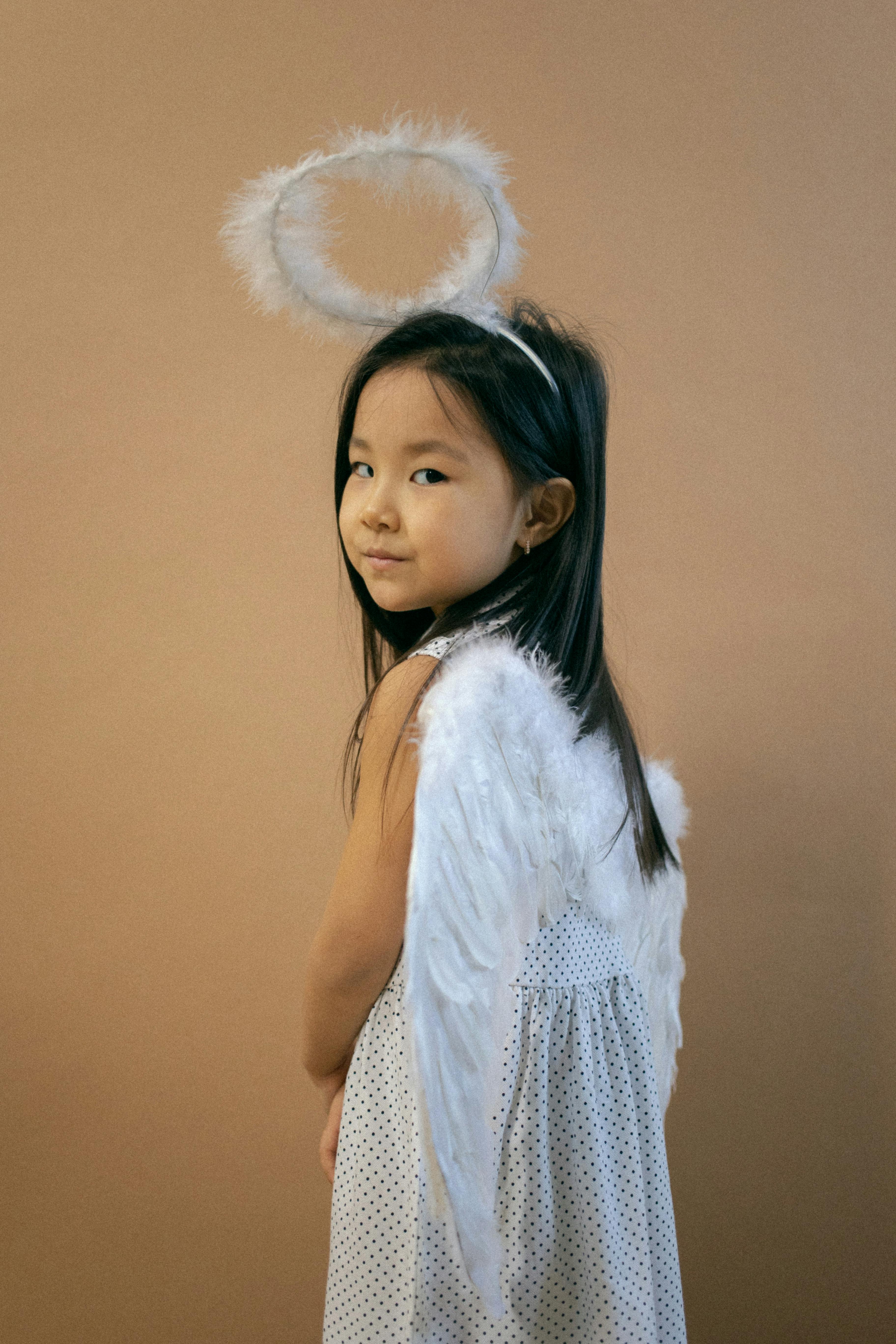 Cute Asian girl in angel costume · Free Stock Photo