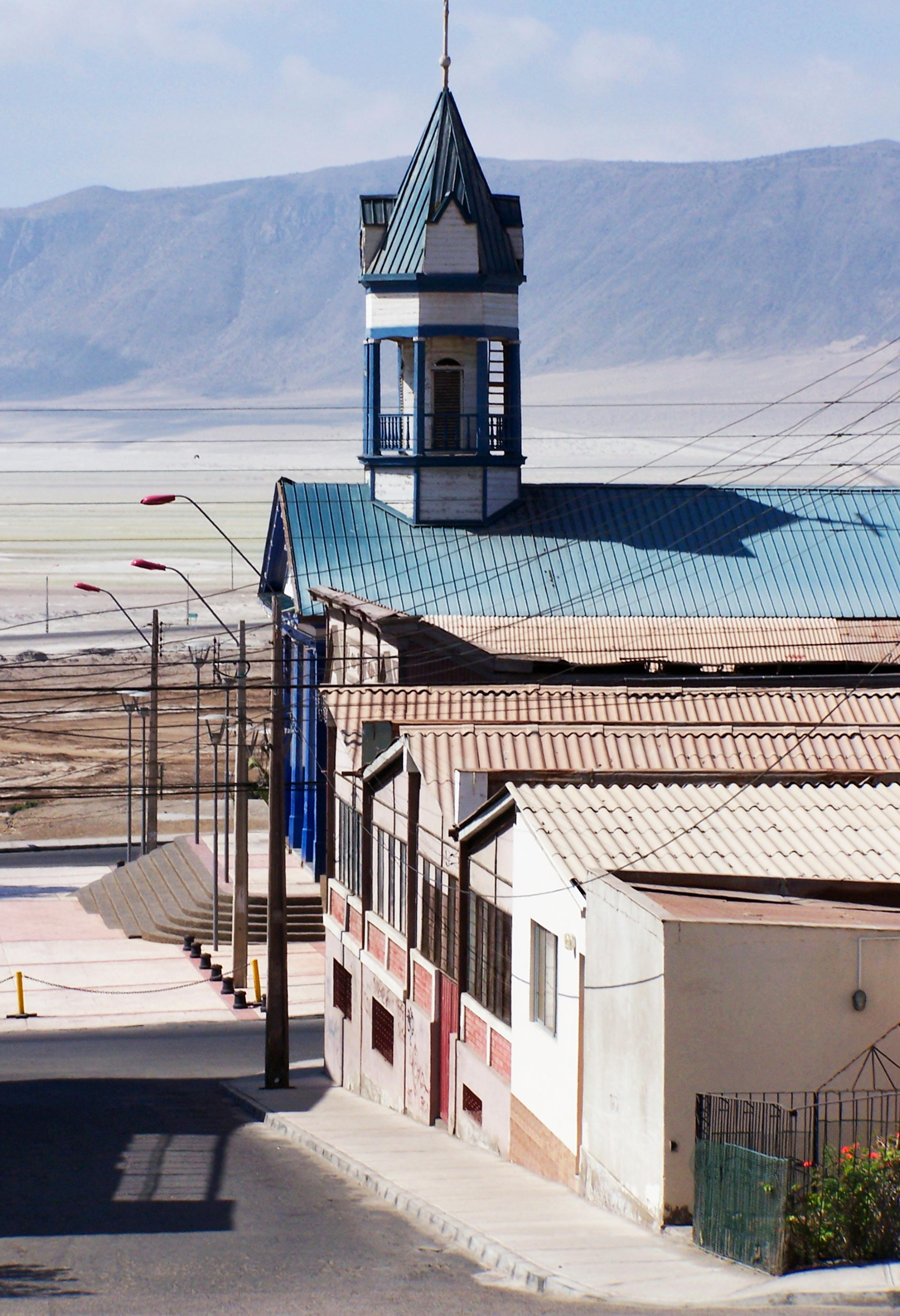 Church Building beside Houses on Roadside · Free Stock Photo
